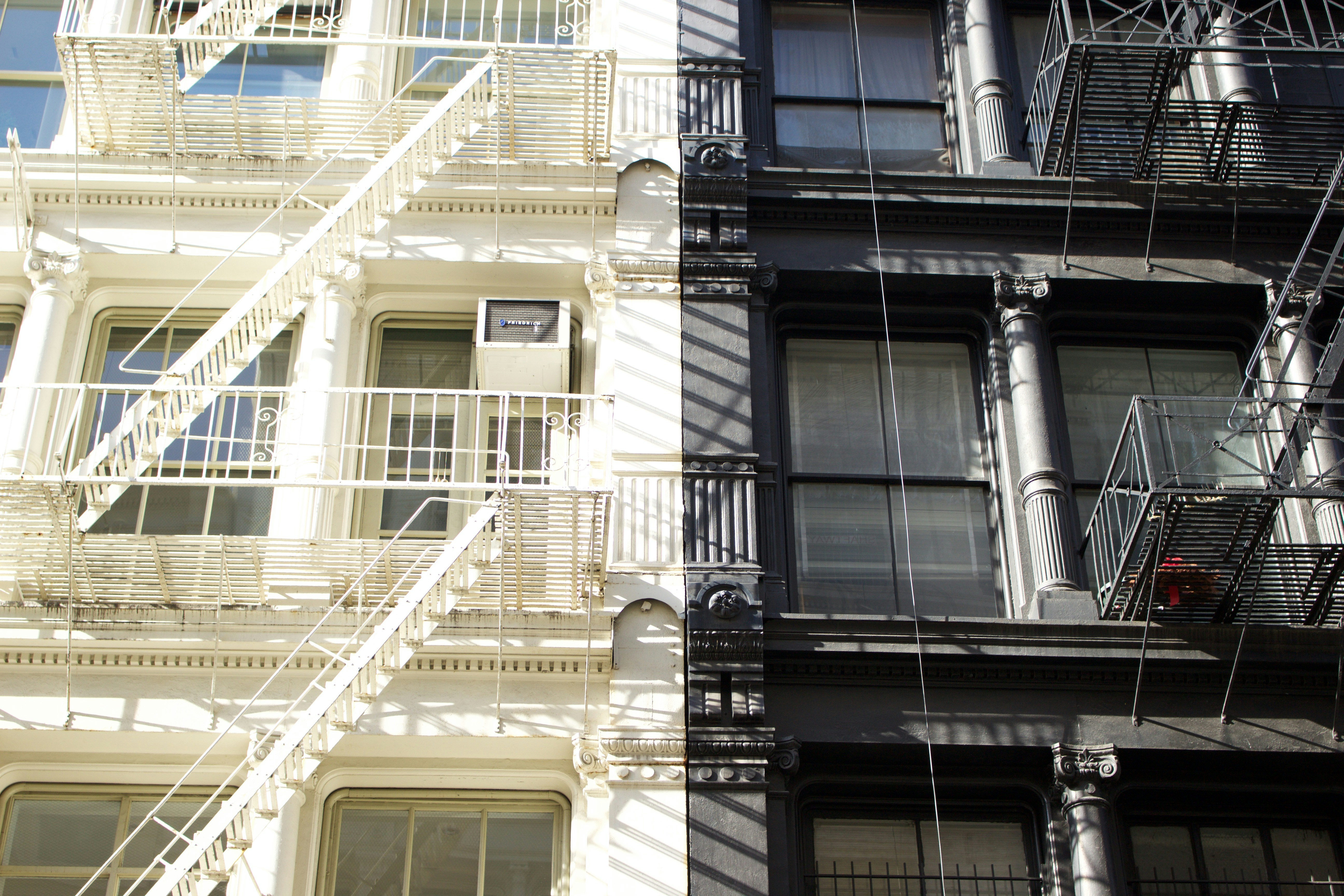 Split Facades: Light and Shadow Play Across Two Cityfronts