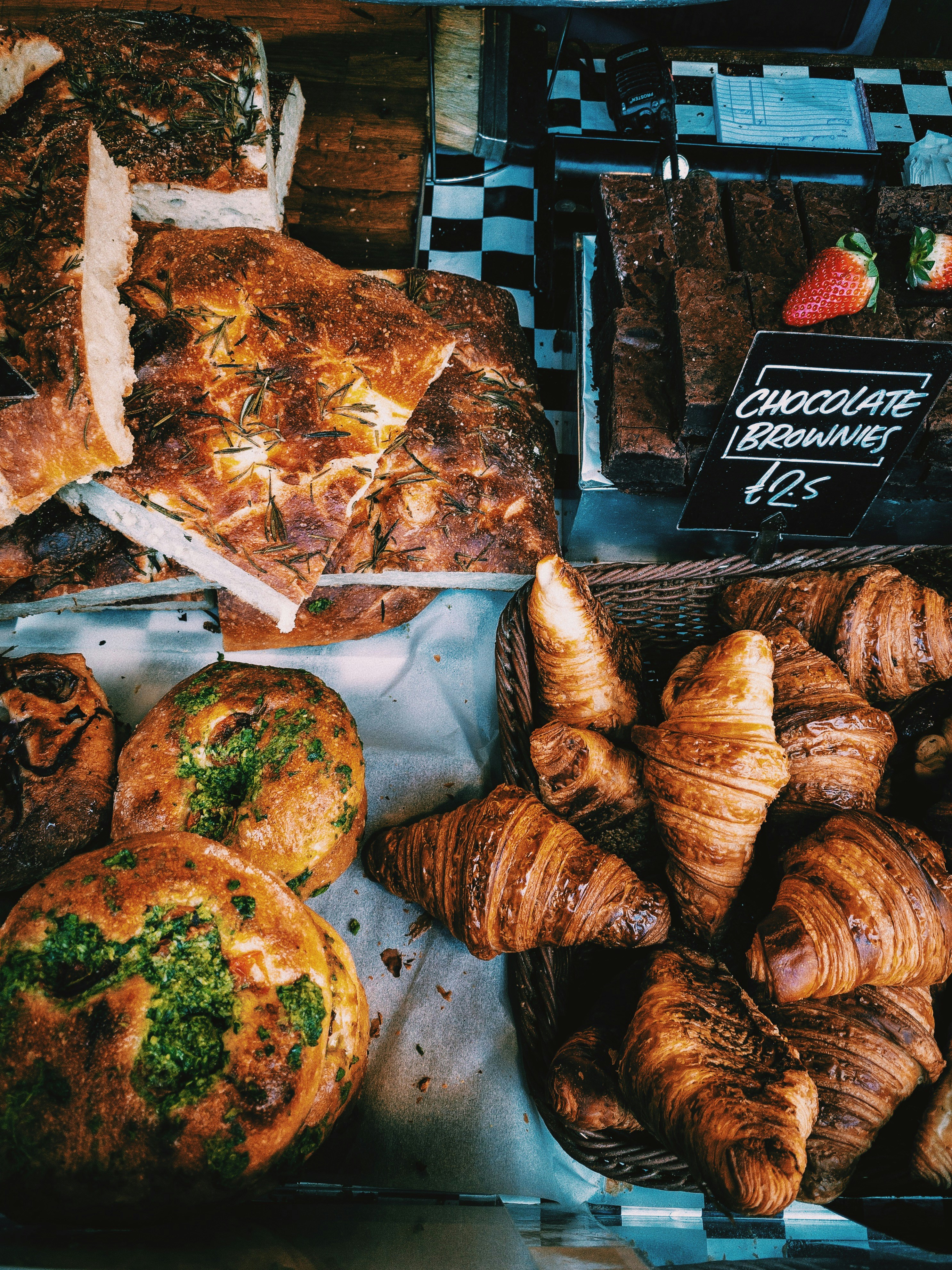 Crusts in Focus: Croissants and Breads at a Busy Bakery Display