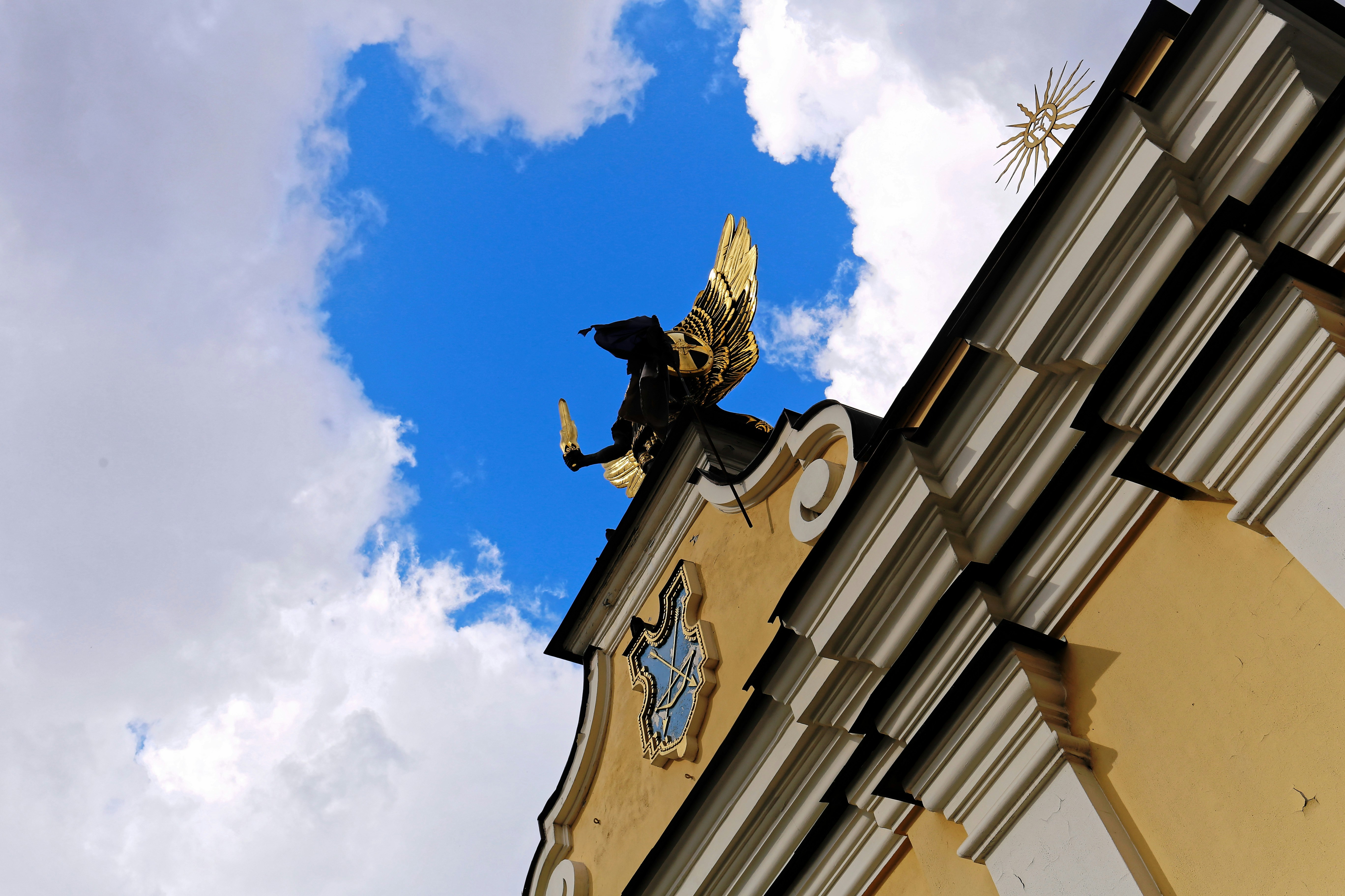 Majestic Winged Sculpture Against Azure Skies