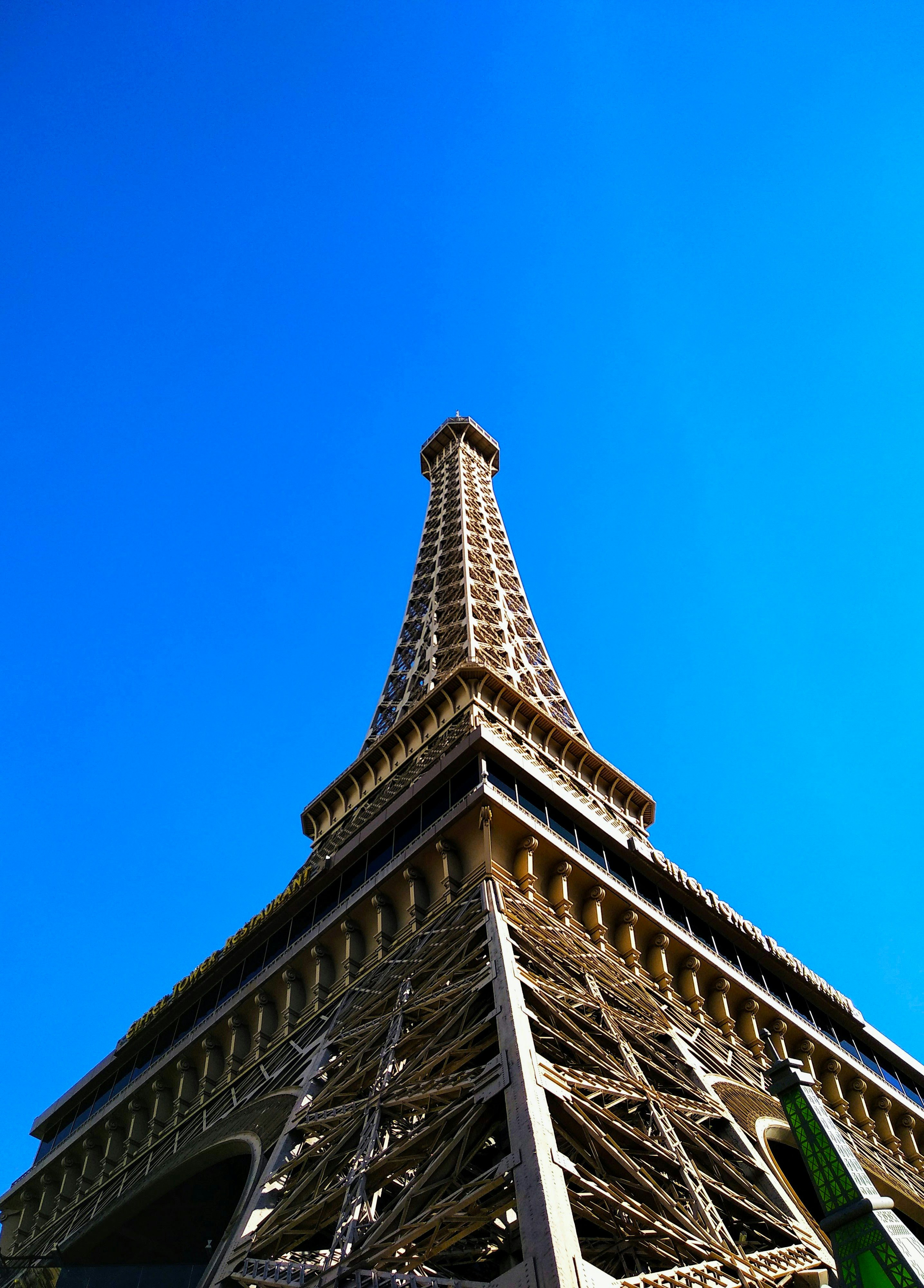 Cerulean Sky and Iron Lace: The Eiffel Tower Reaches Up