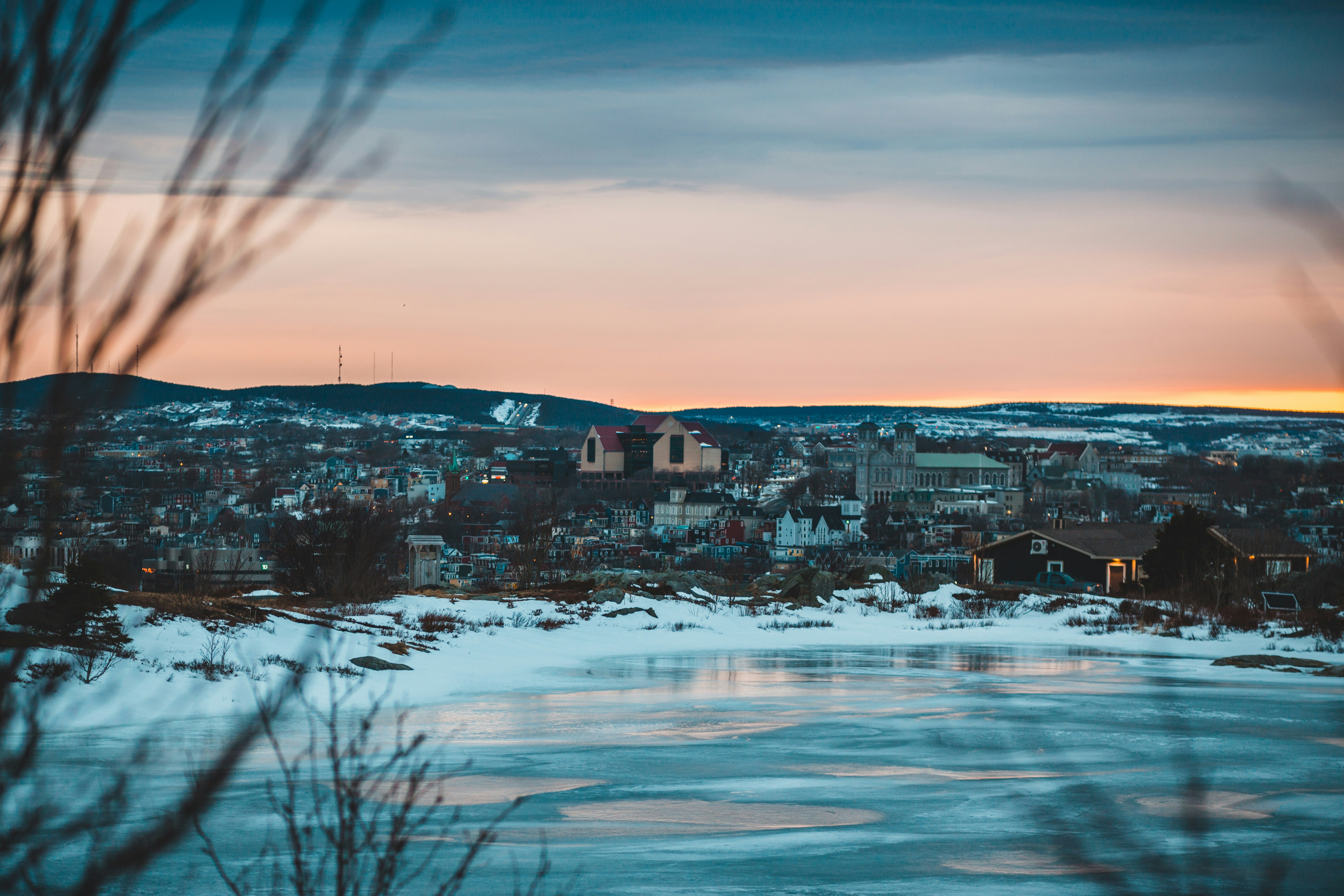 Sunset over houses in beach photo – Free Nature Image on Unsplash