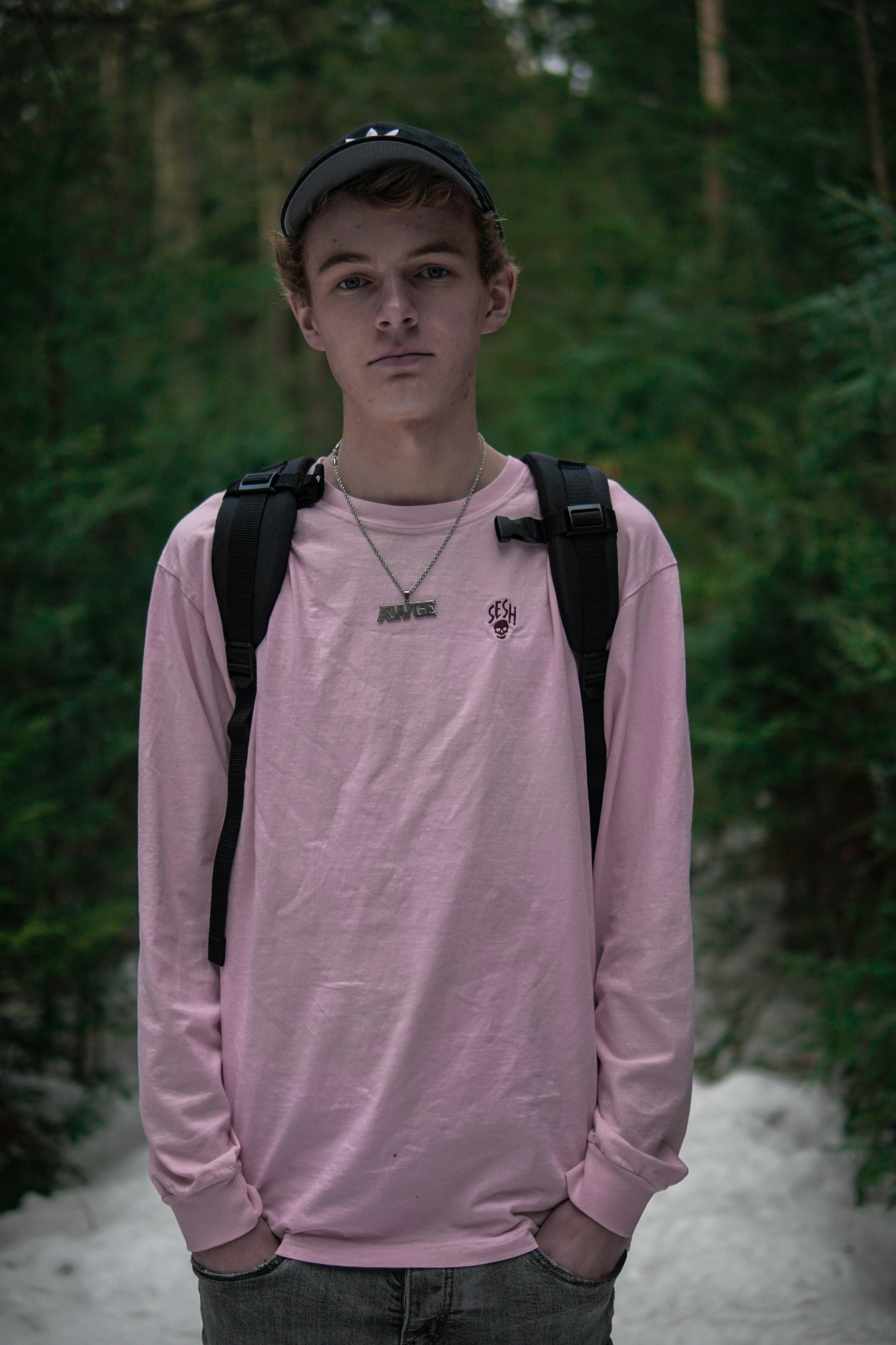 man wearing pink crew-neck shirt