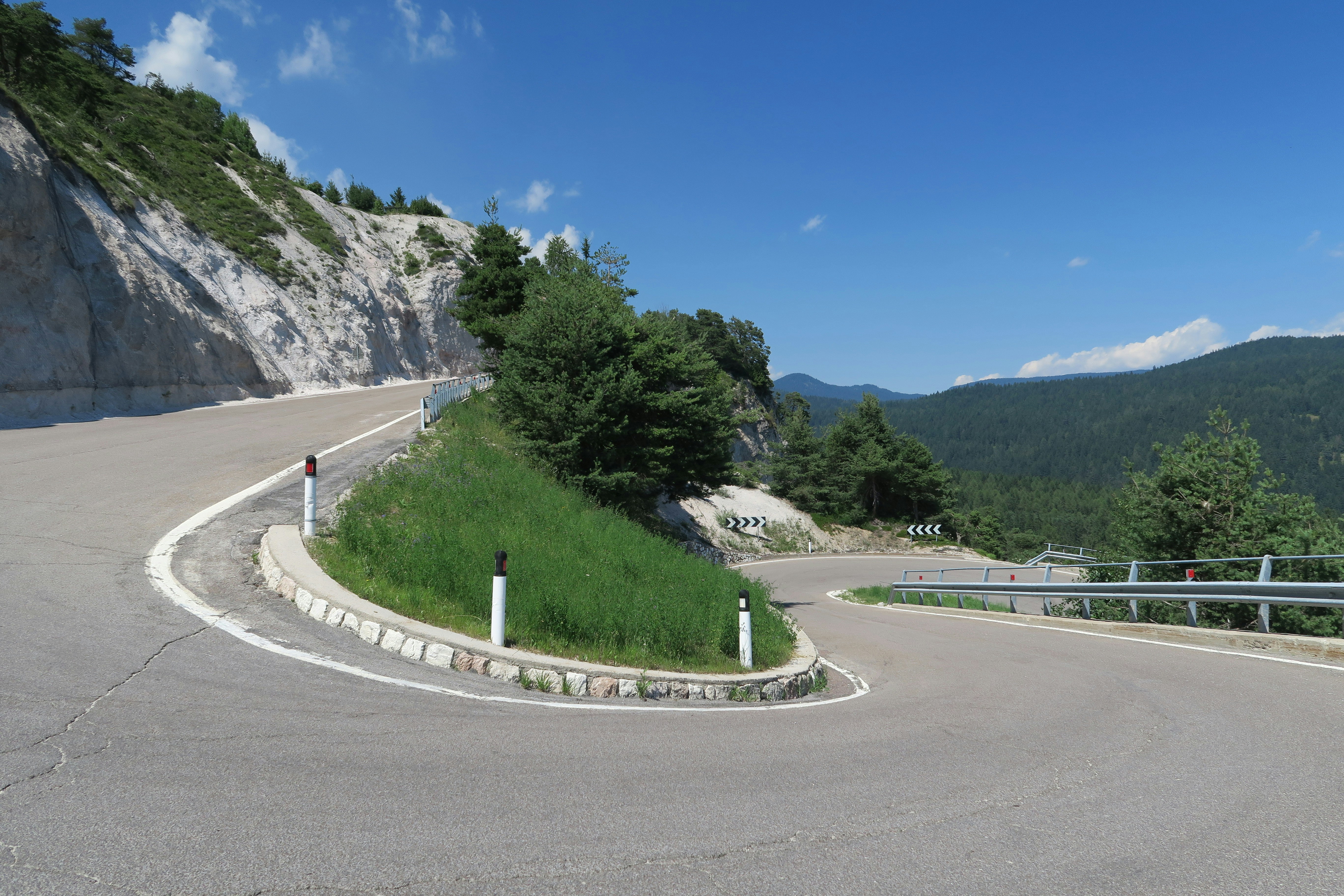 Serpentine Switchback Under Limestone Cliffs and Sky