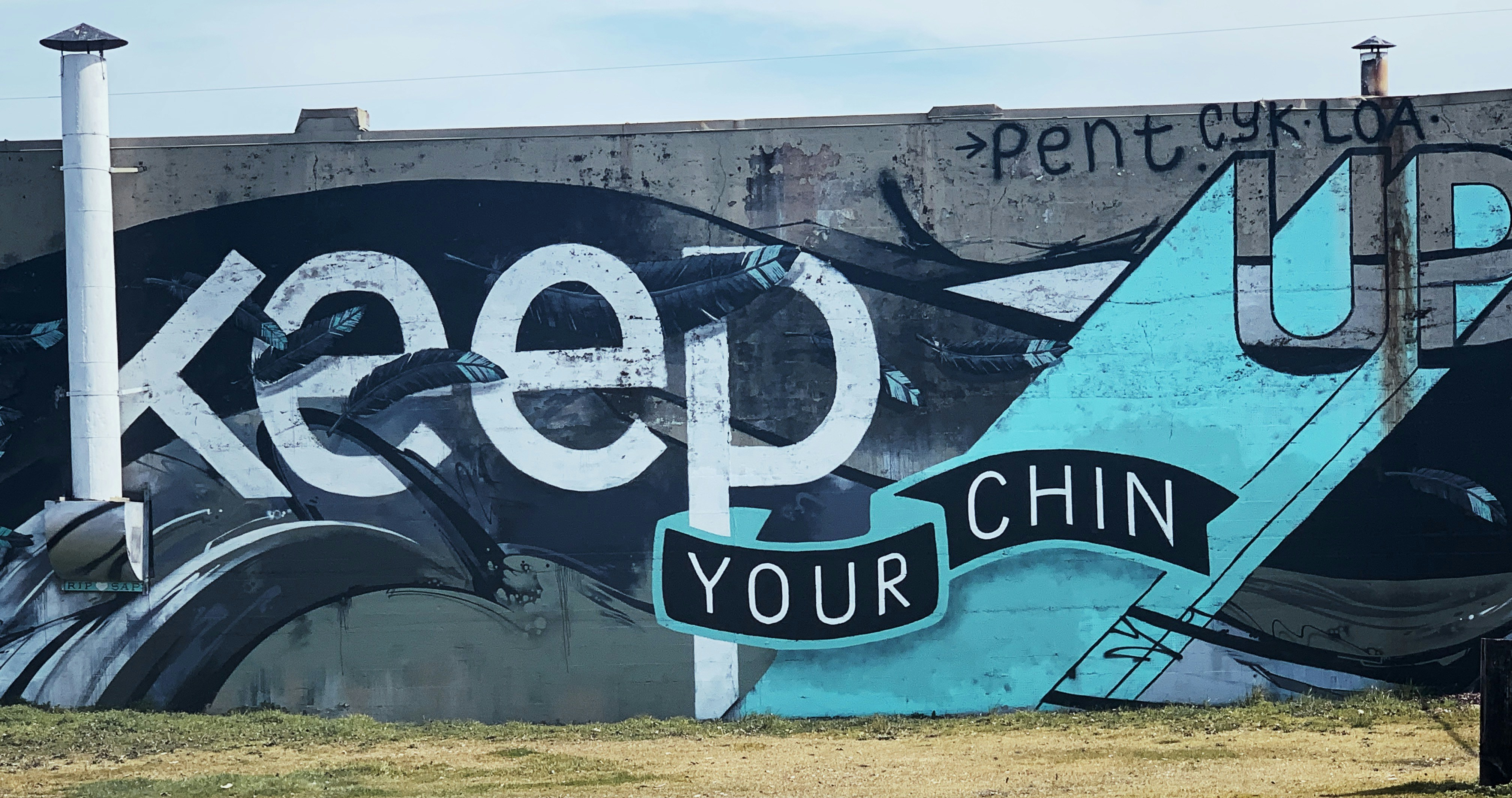 keep your chin up wall graffiti