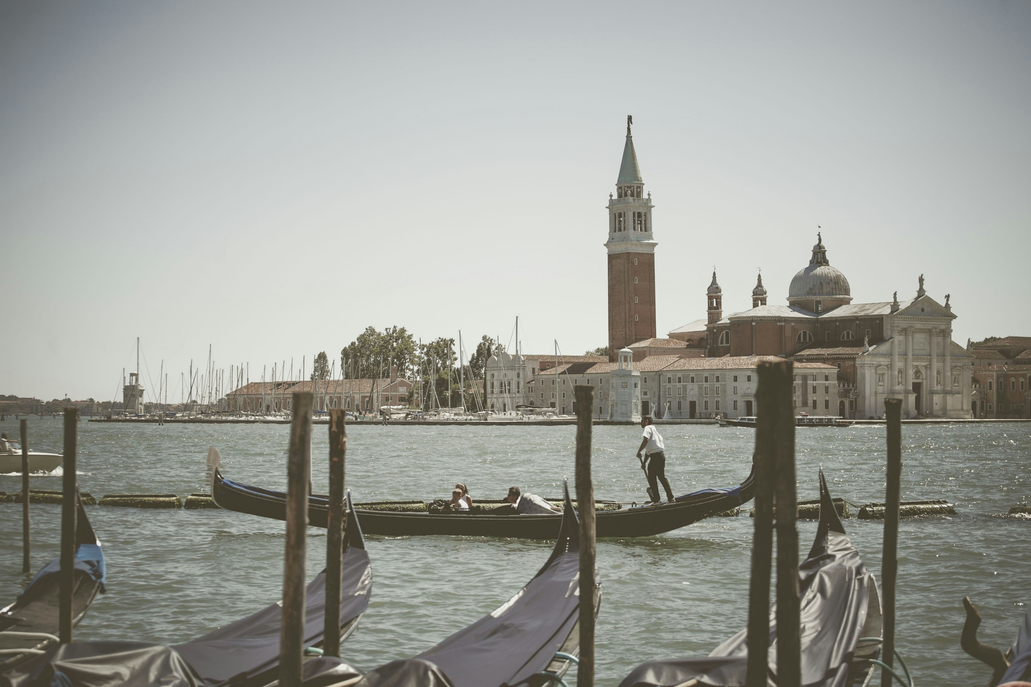 Gondolier Pause on Venice's Waterfront