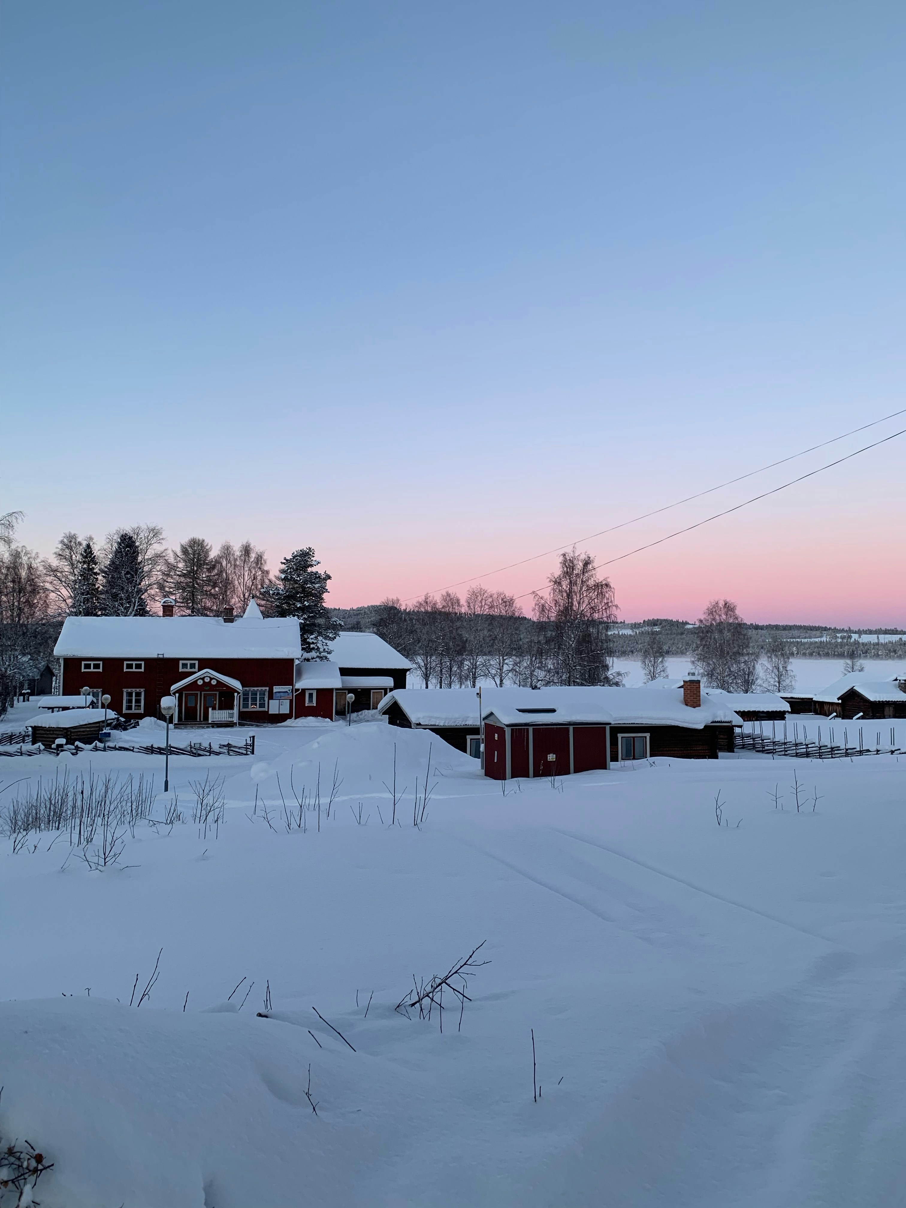 Snowbound Homestead Under a Pink Dawn