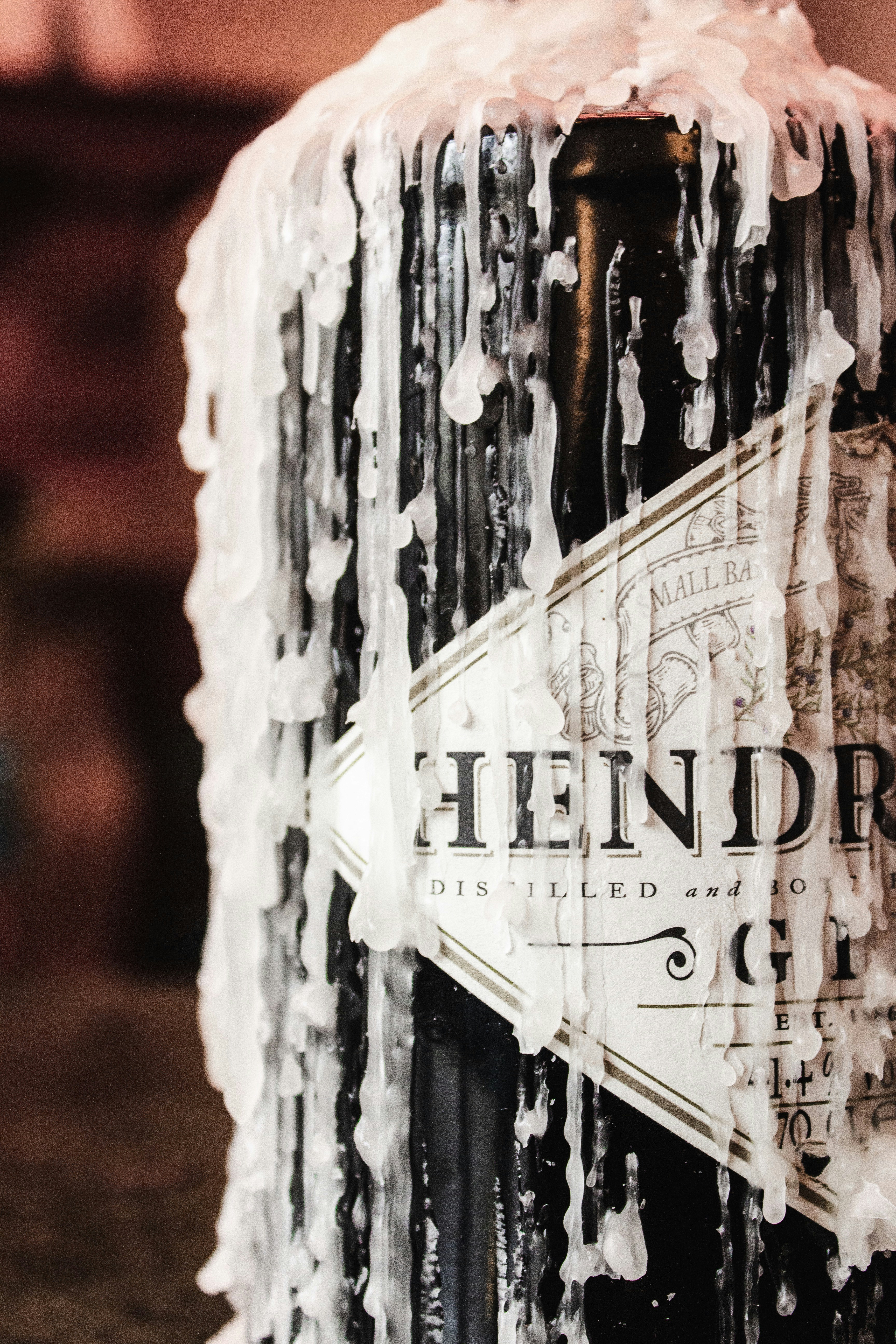 Black candle holder with candle metls photo – Free Bottle Image on Unsplash