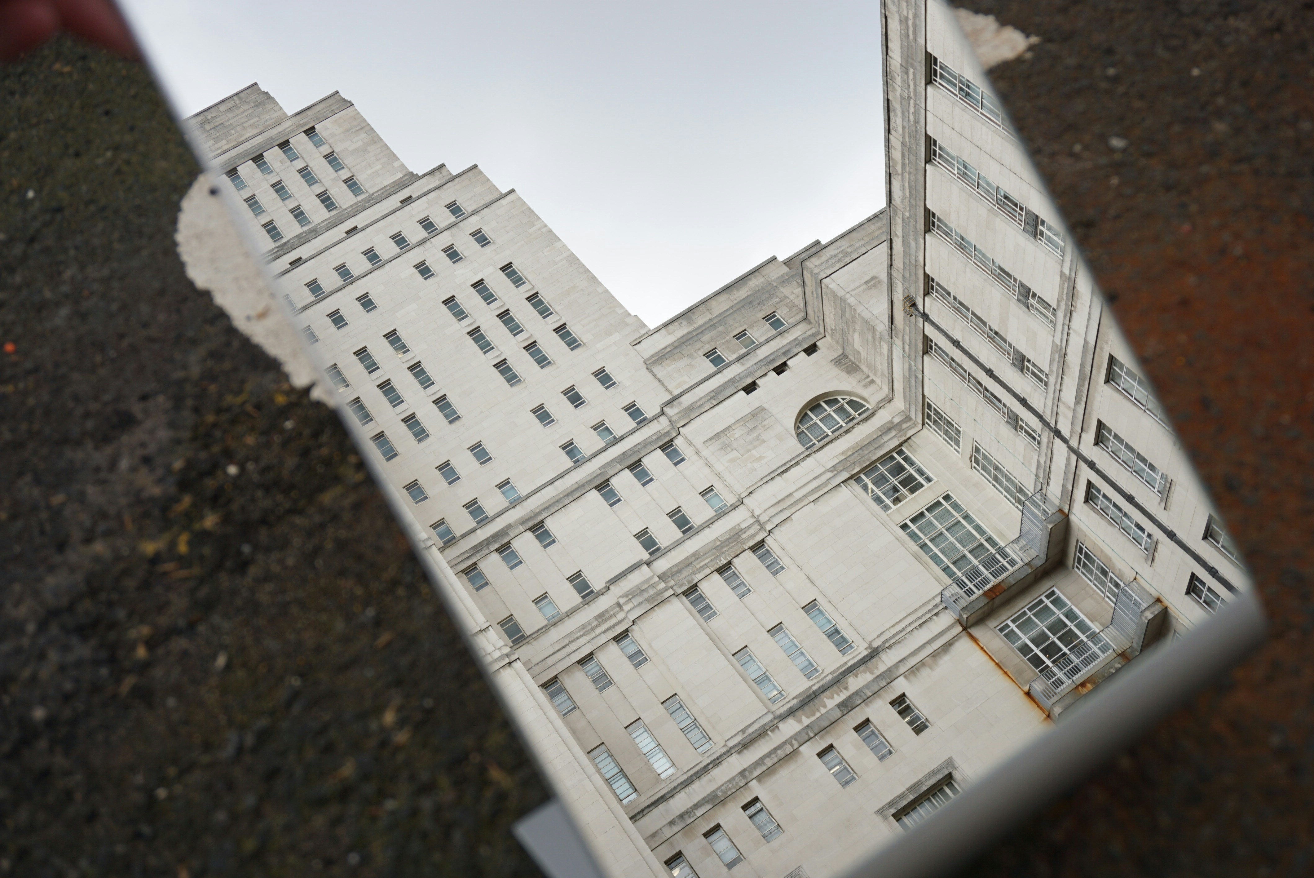 Reflection of a City Facade in a Rain-Wet Asphalt