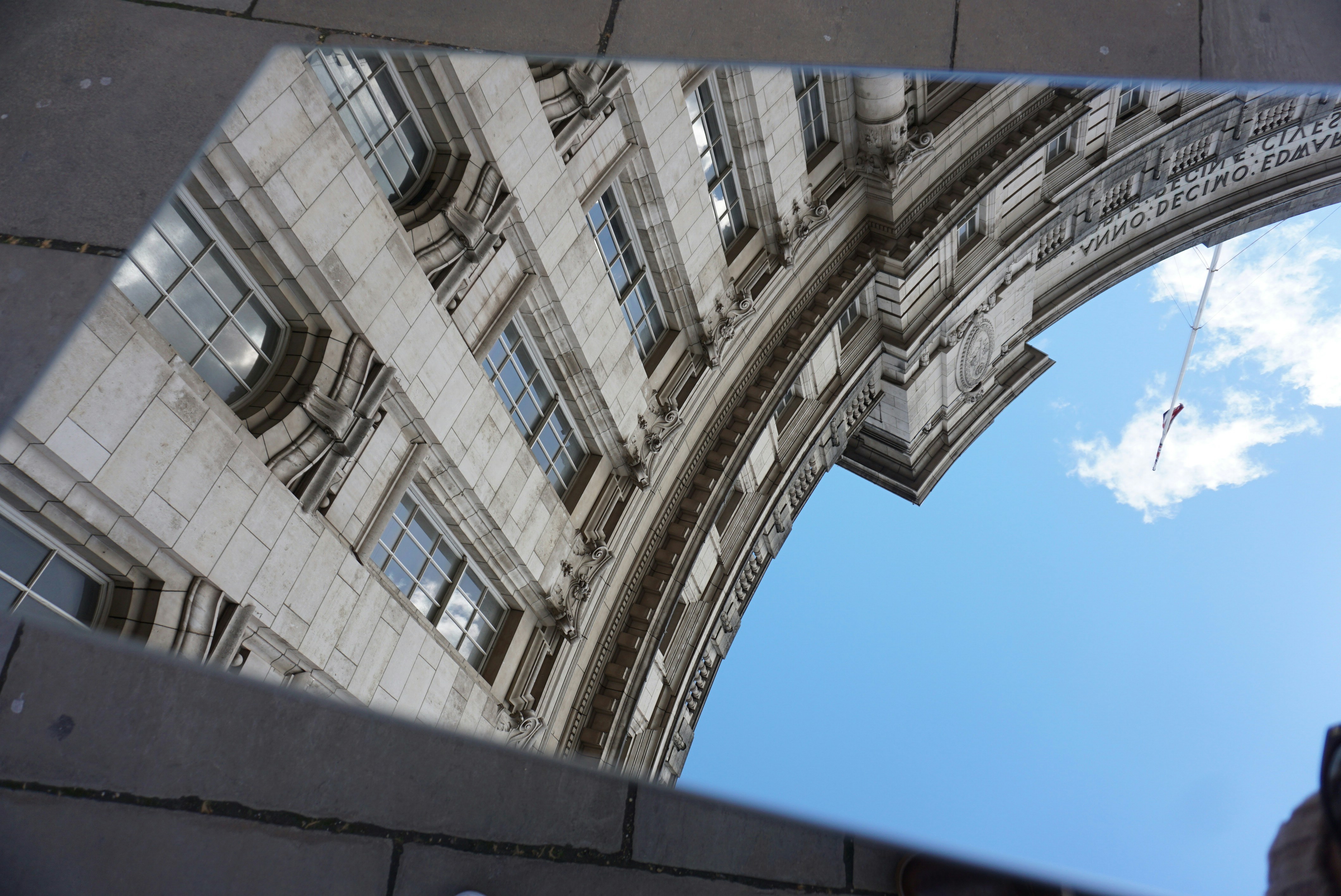 Archways in the Sky: Curved Facade Reflected on a Tilted Plane