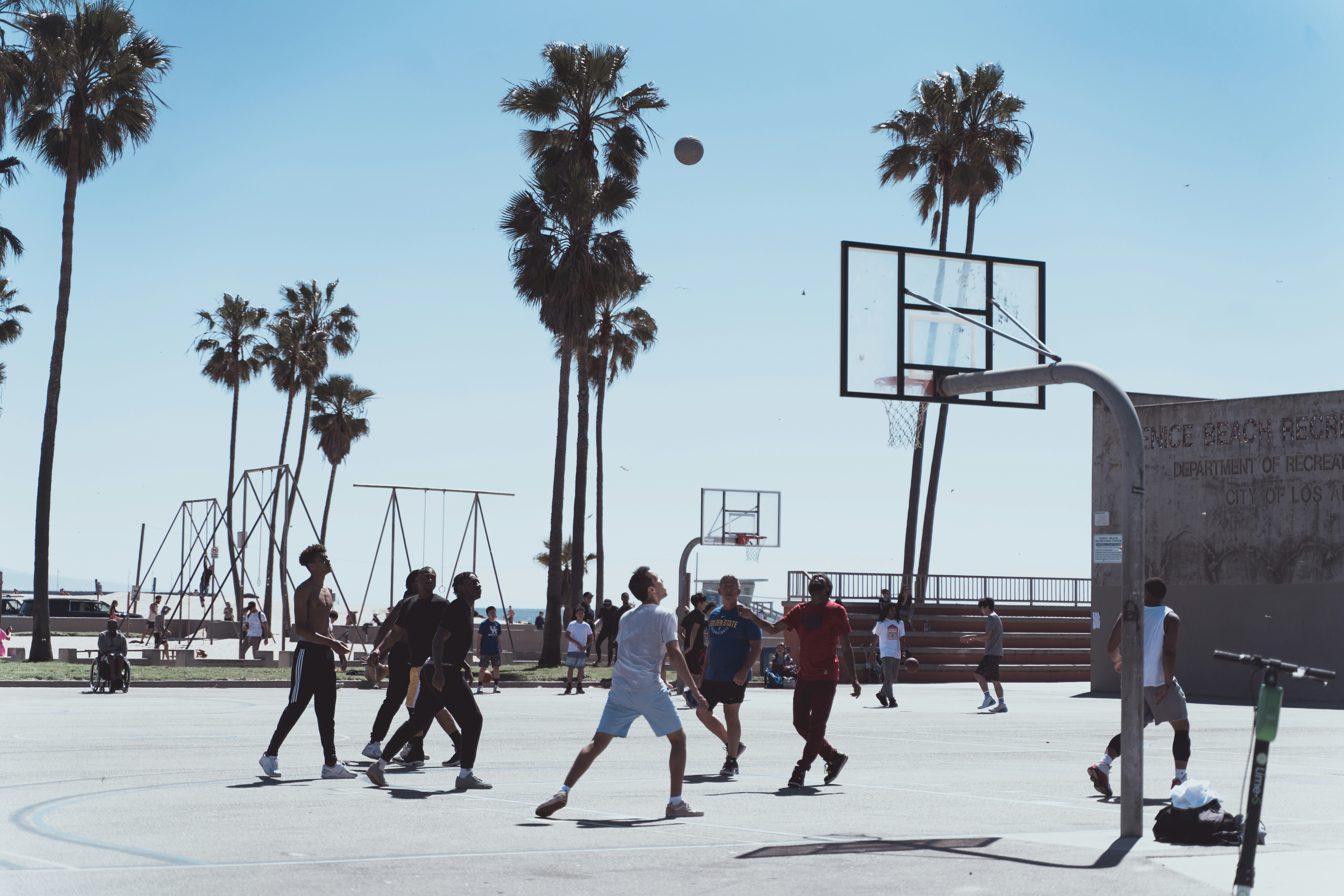 men playing basketball during day