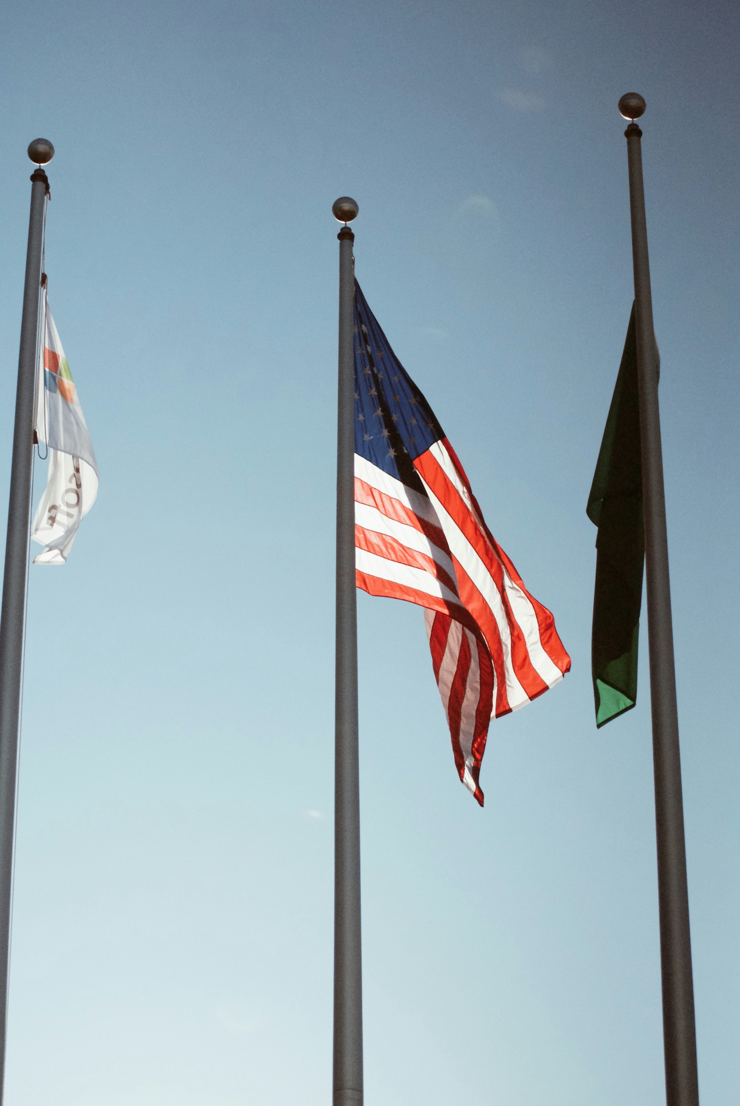 USA flag between two flags at the flag pole photo – Free Symbol Image ...