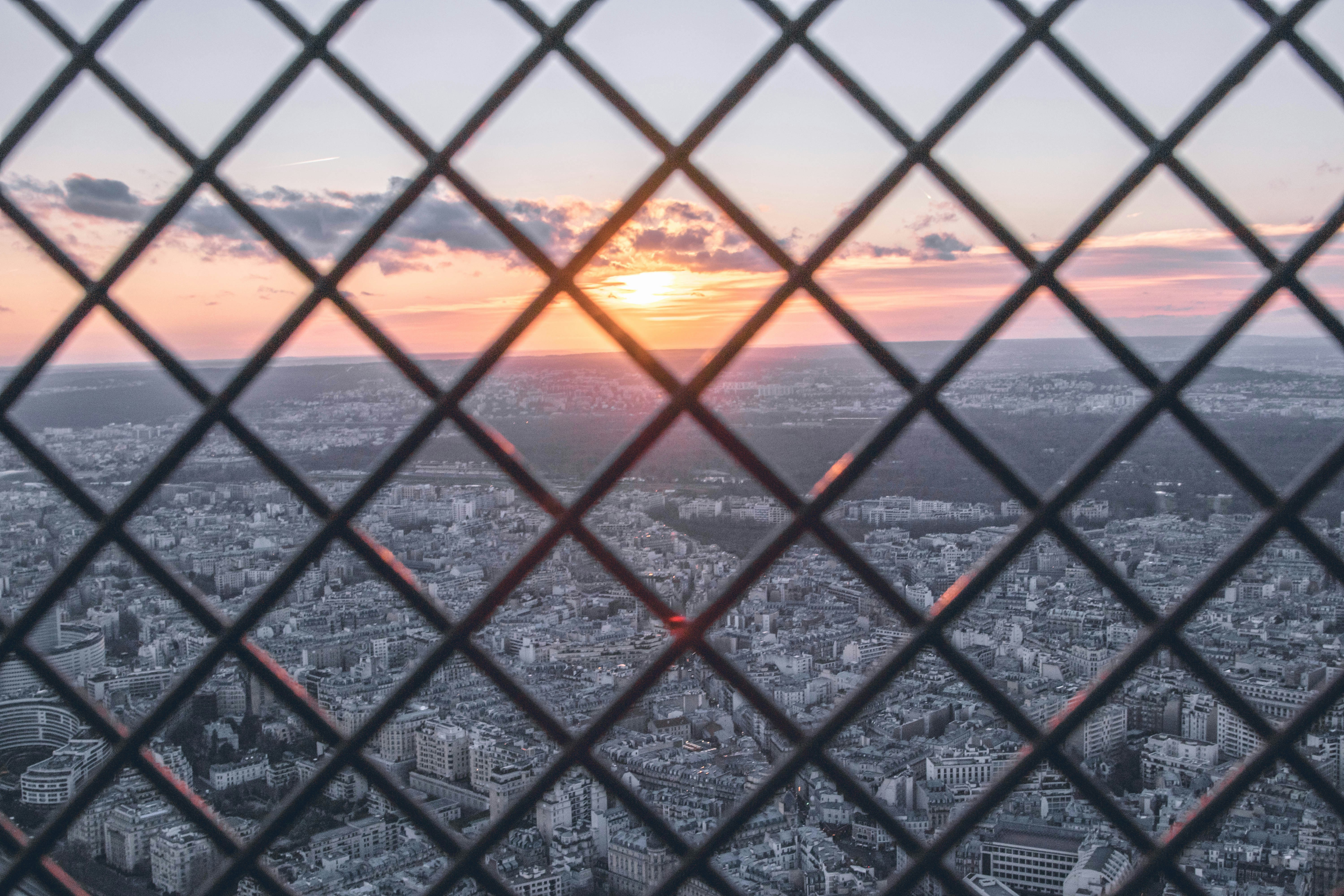 Cyclone fence top-view on buildings during sunset photo – Free Sunset ...