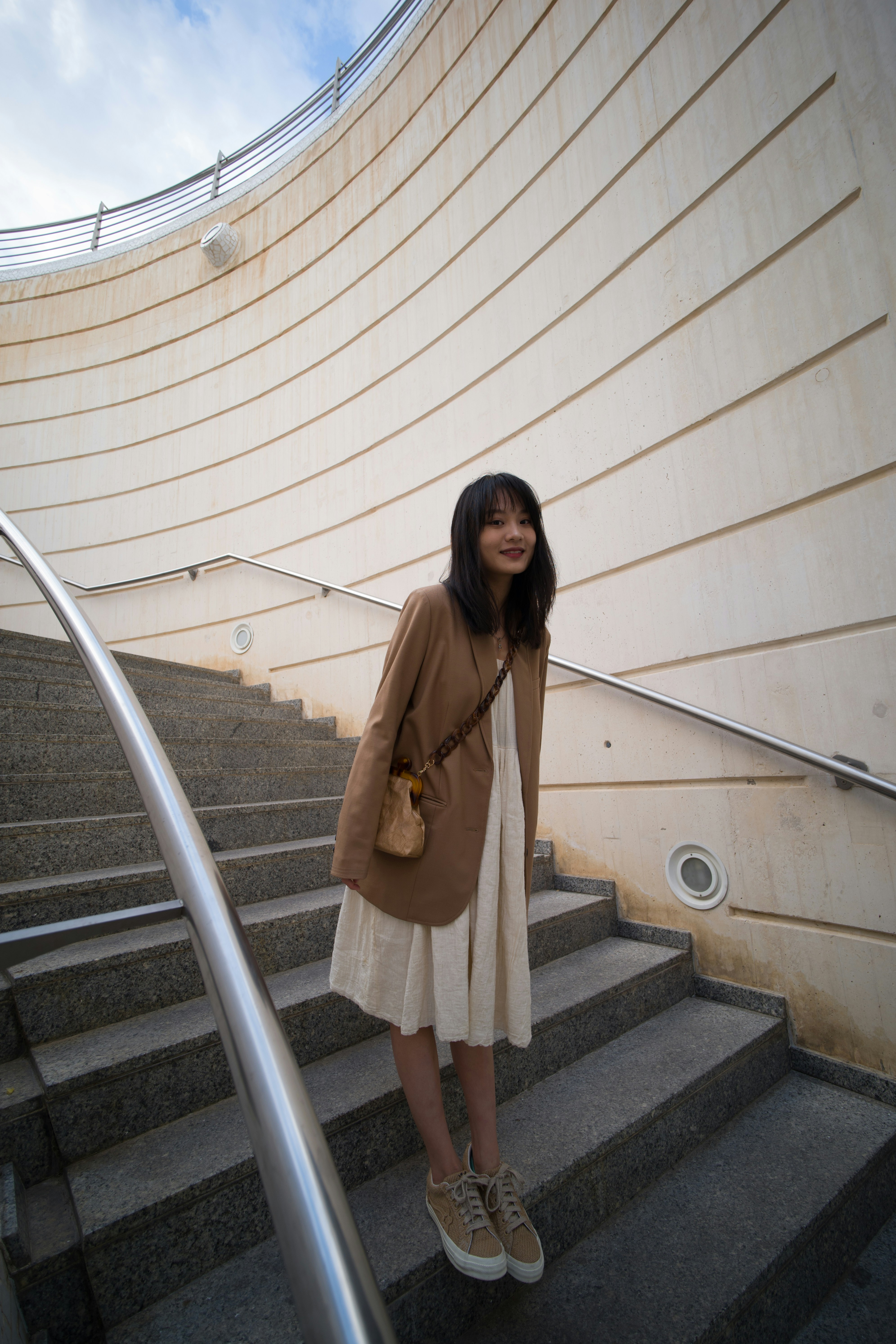 Softly Curved Walls and Gentle Steps: A Portrait on the City Staircase