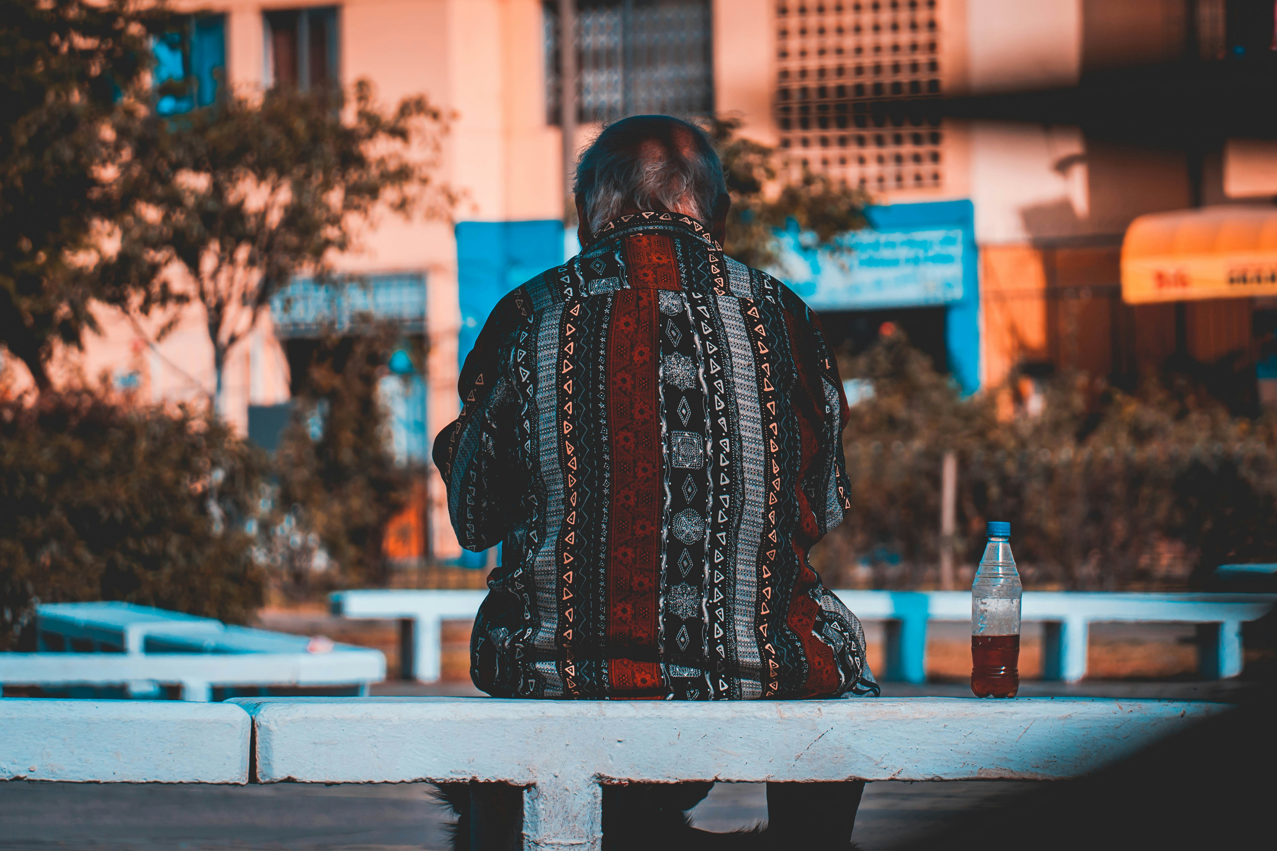 Urban Quiet on a Bench: Patterned Knit and Dusk-Soft Light