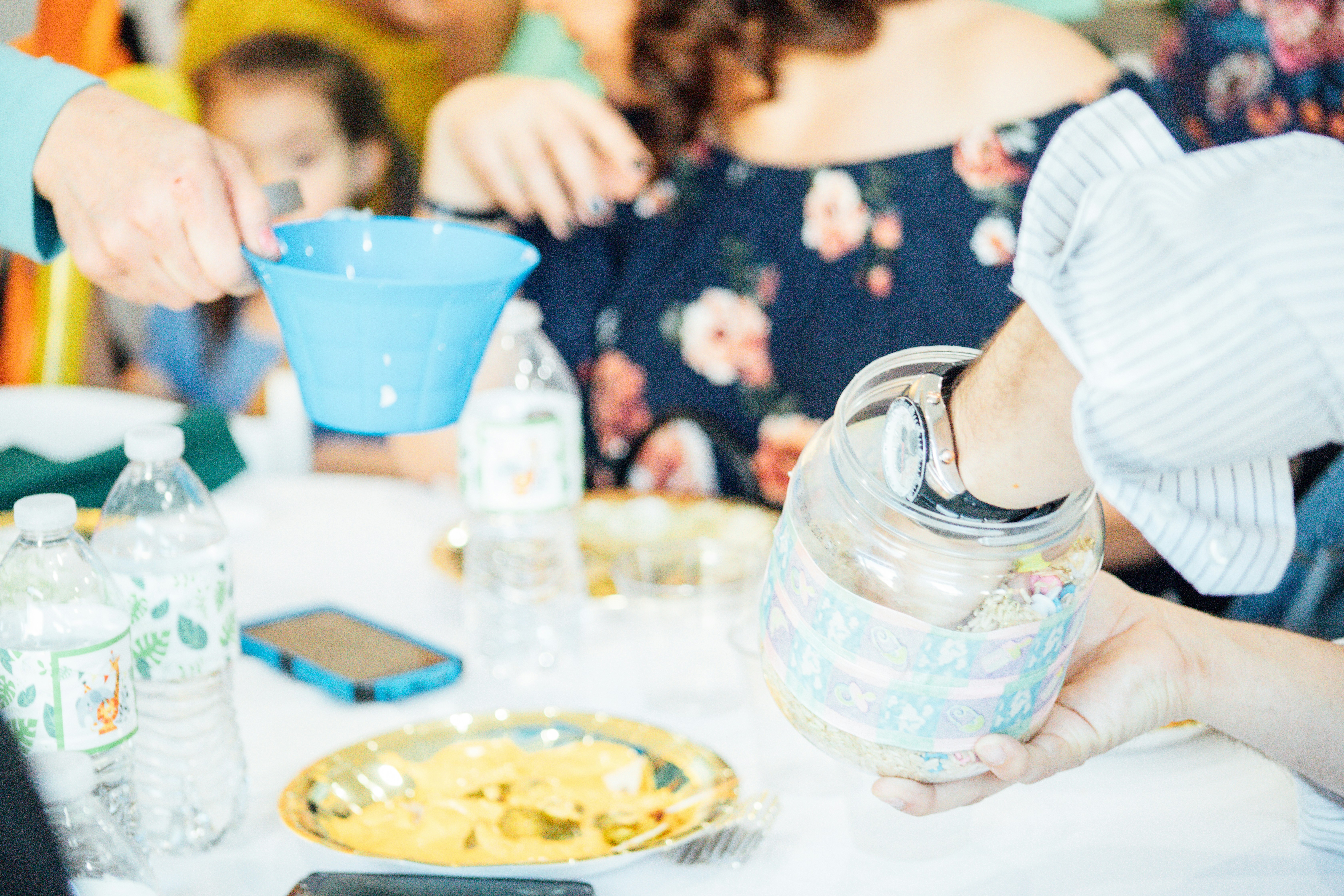 Blue Funnel Pour: A Communal Moment Over a Jar at the Table