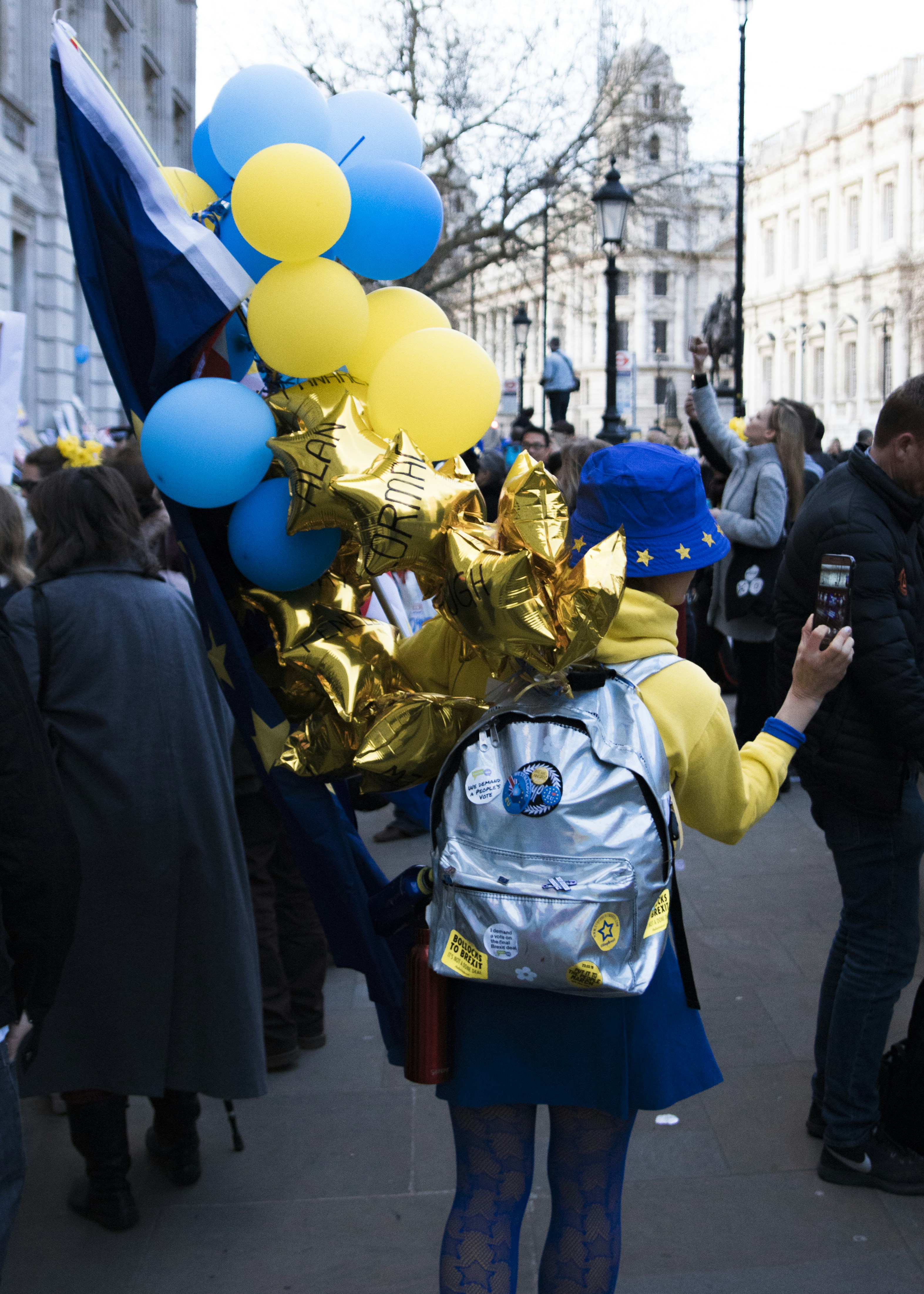 Balloon Parade in Blue and Yellow in a City Crowd