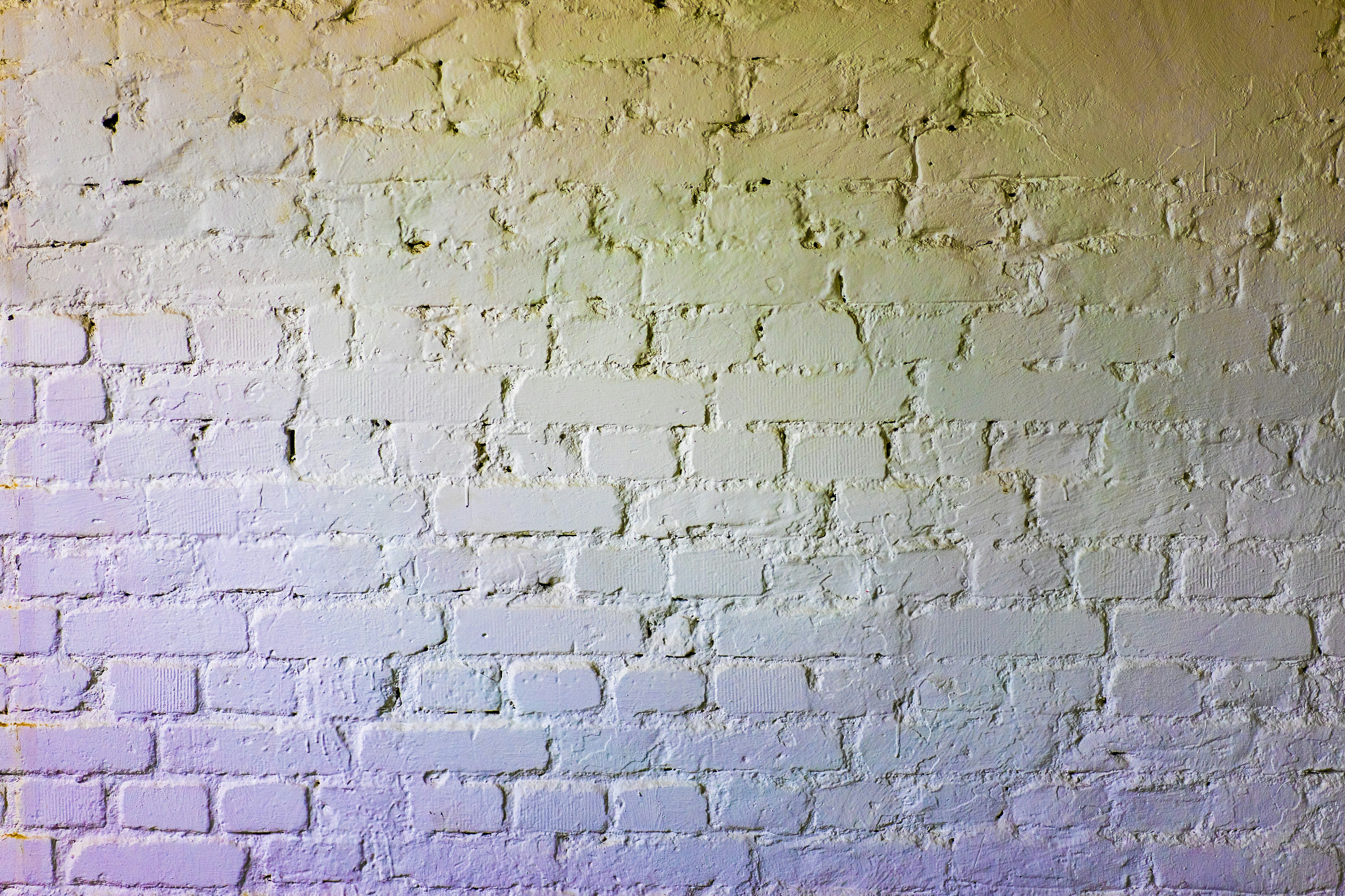 Pastel Prism Draped Across a Weathered Brick Wall