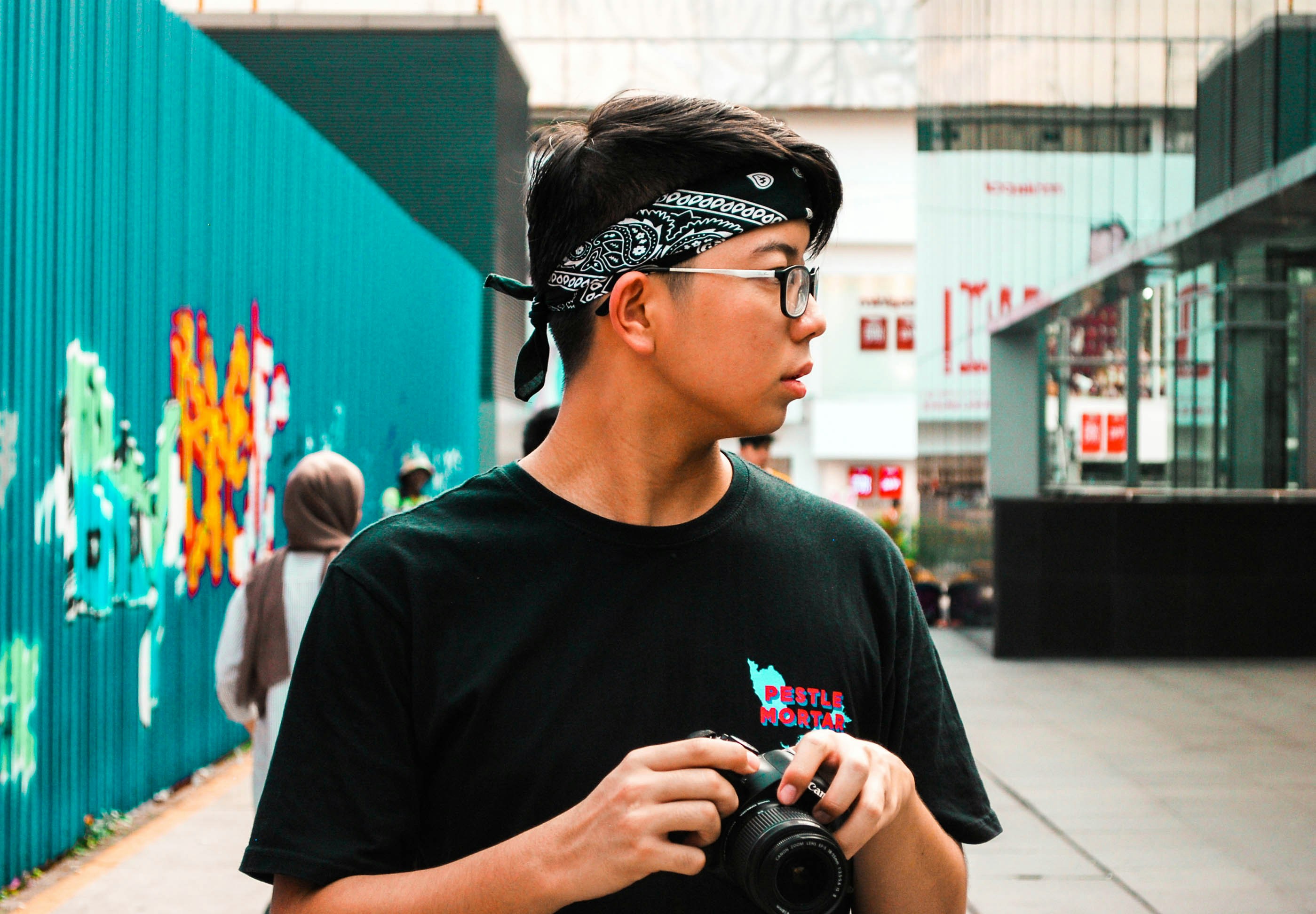 man facing left side holding cameraK X I T H V I S U A L S