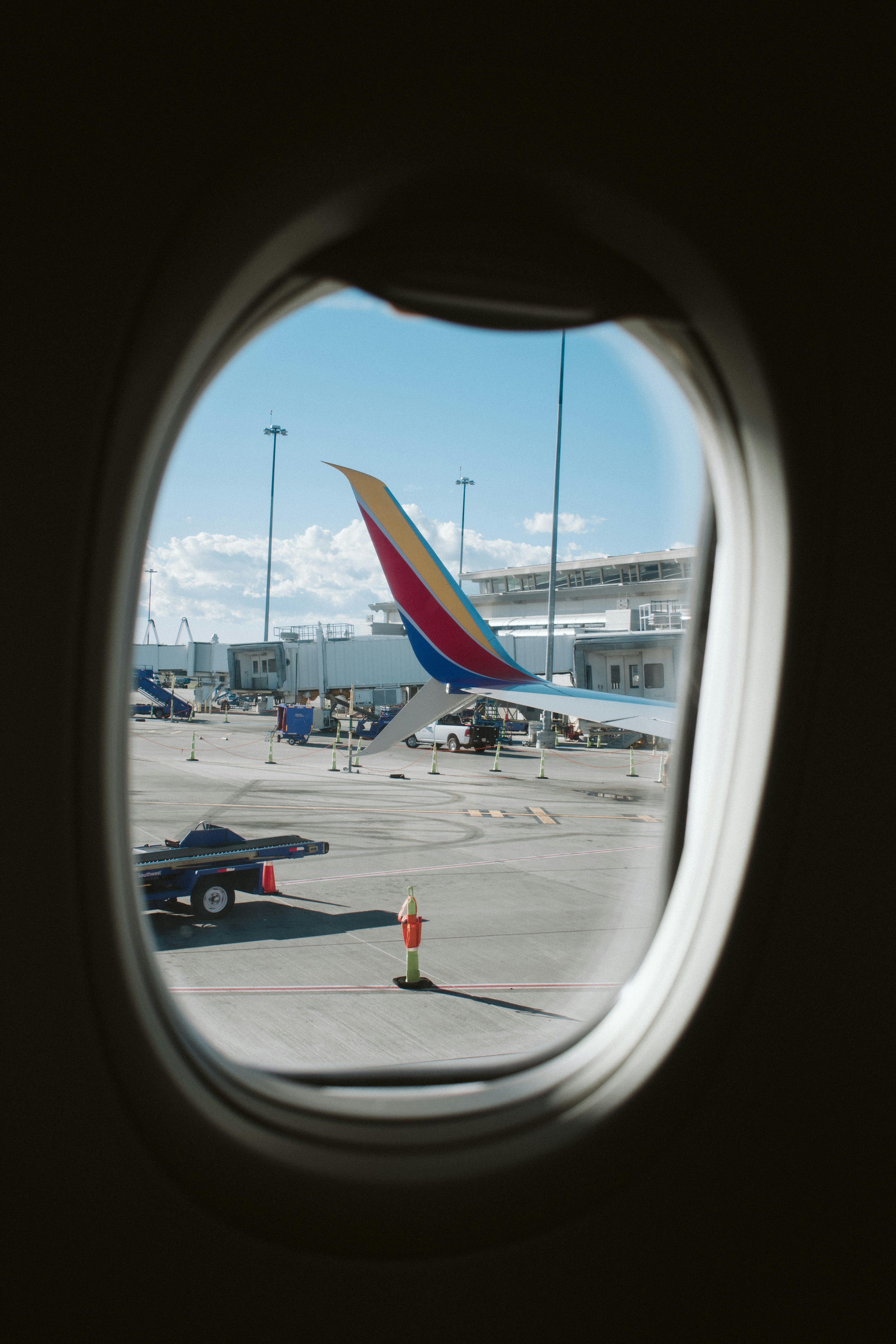 Airliner window showing airport during daytime photo – Free Airplane ...