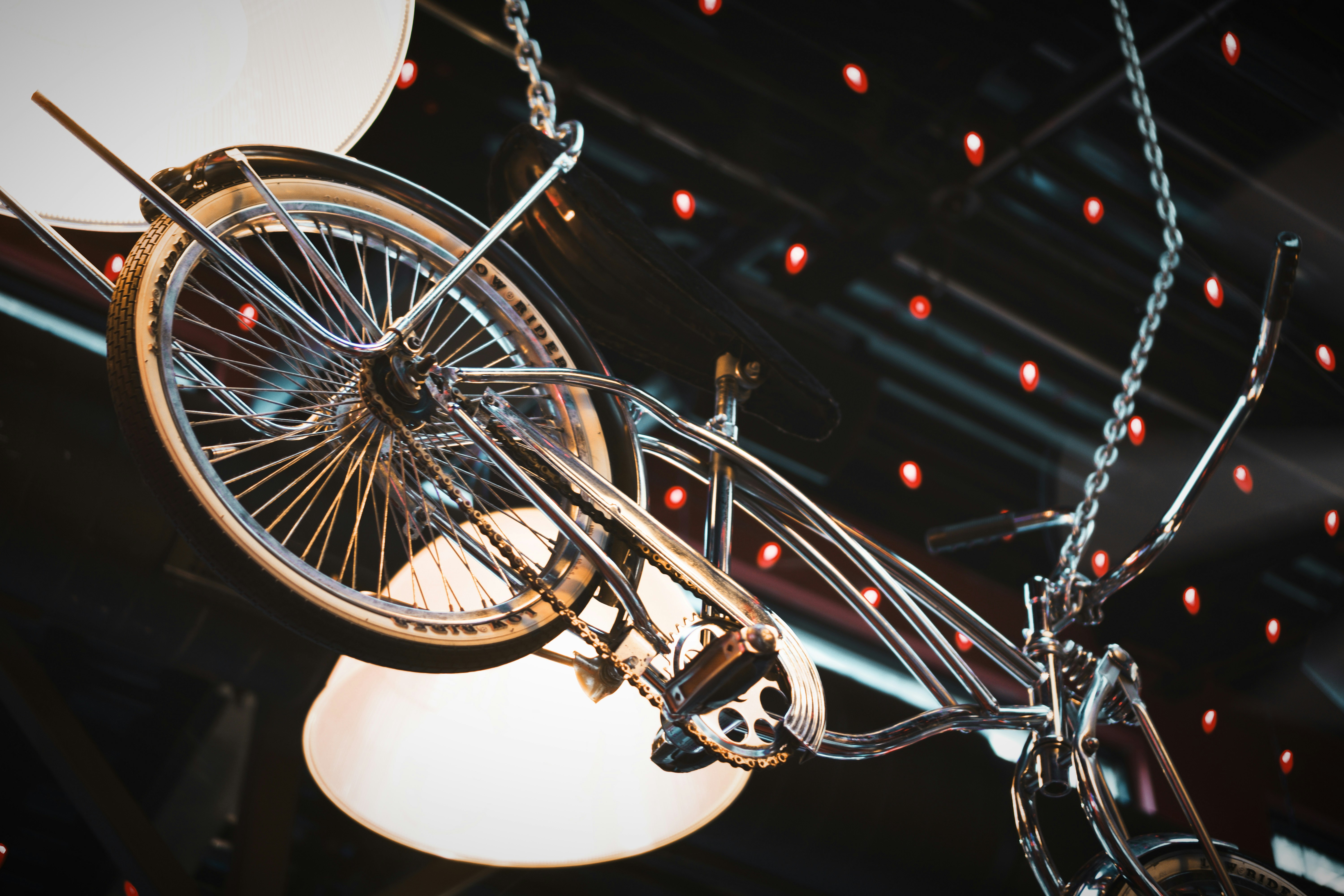 Suspended Bicycle Under a Cascade of Warm String Lights