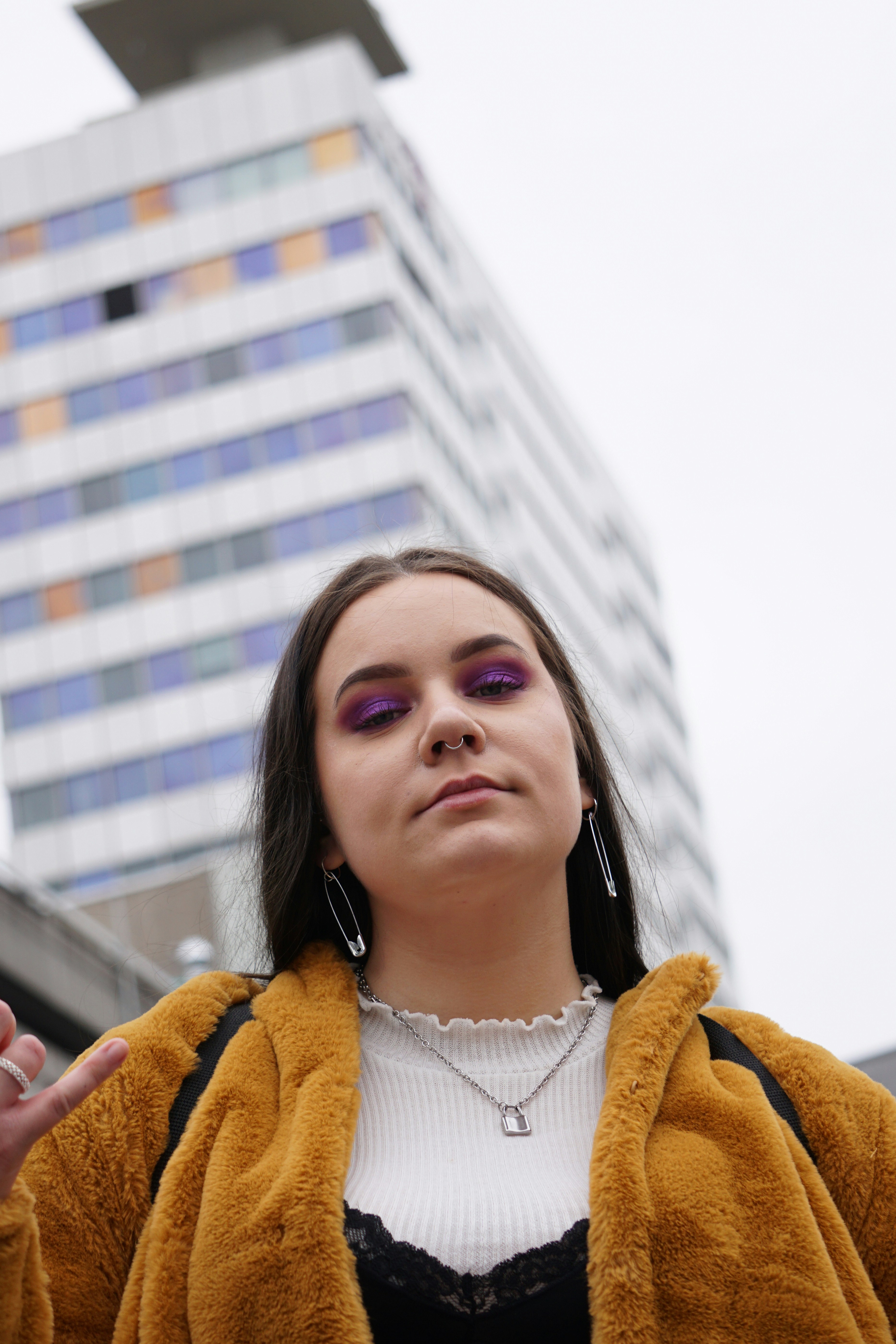 Uplifted Vibes in Neon Glass: Portrait Against a City Backdrop
