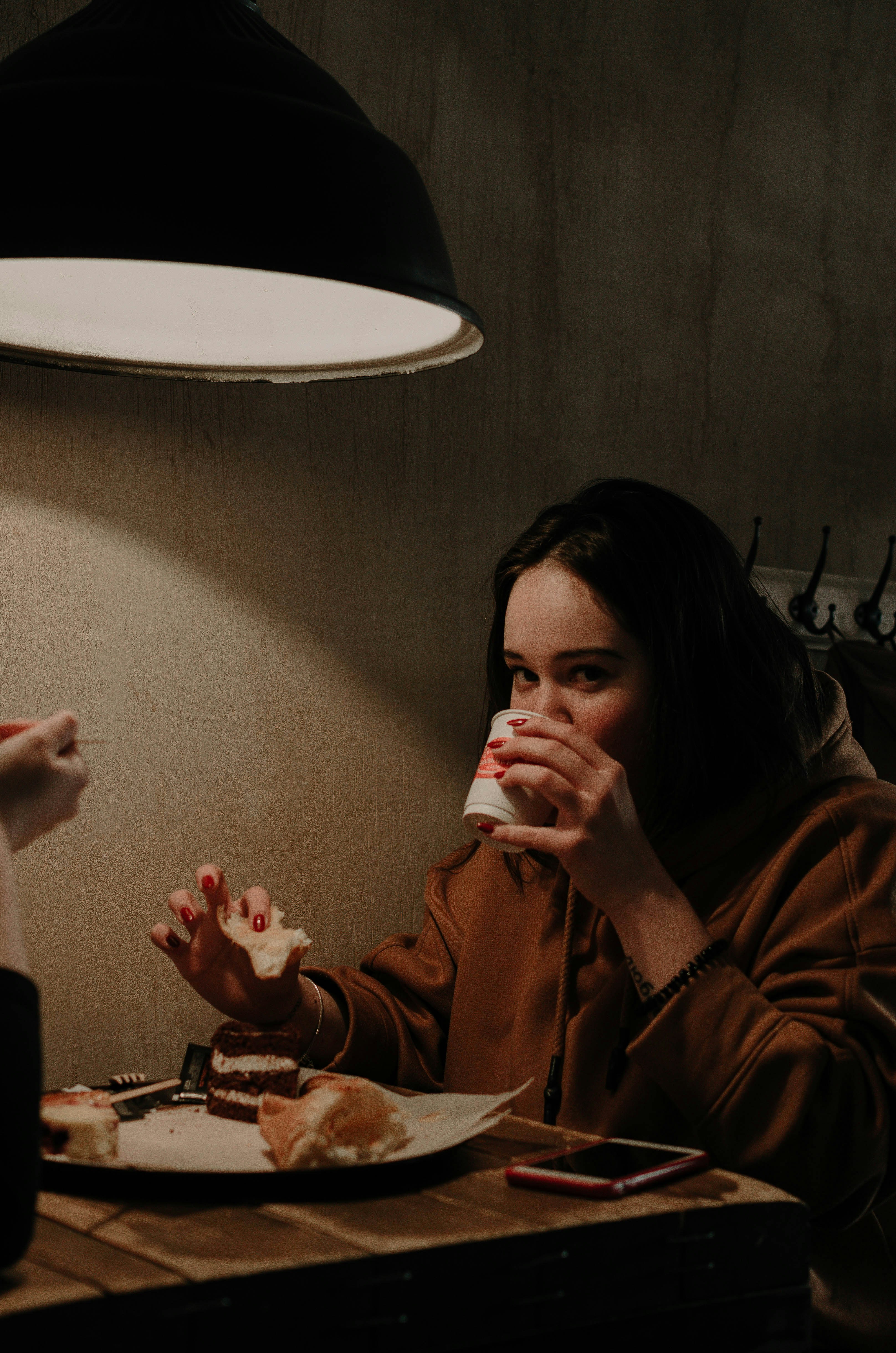 Evening Indulgence: Quiet Conversation Over Cake and Coffee