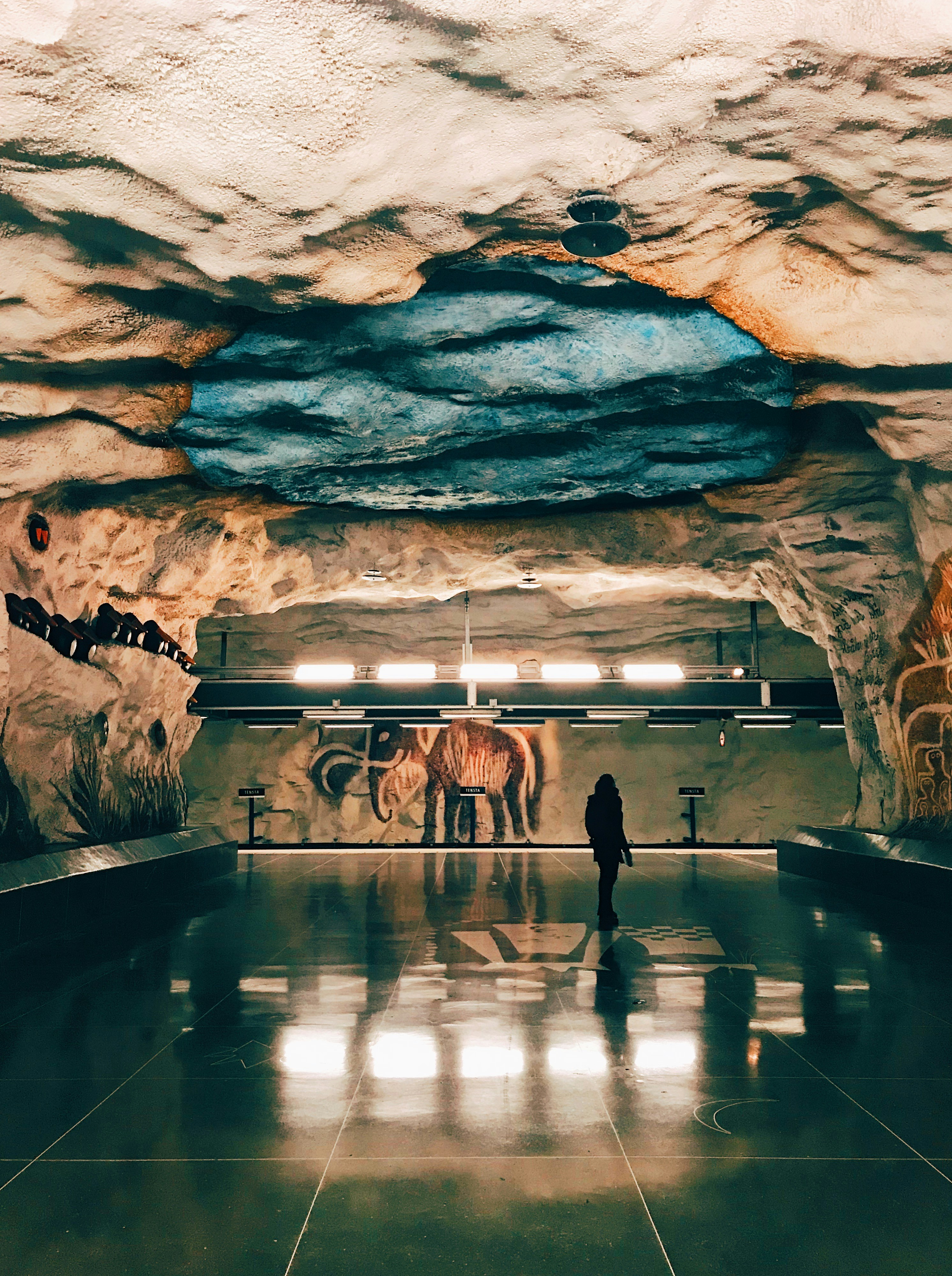 Echoes Beneath the Stone: A Lone Figure in the Underground Gallery