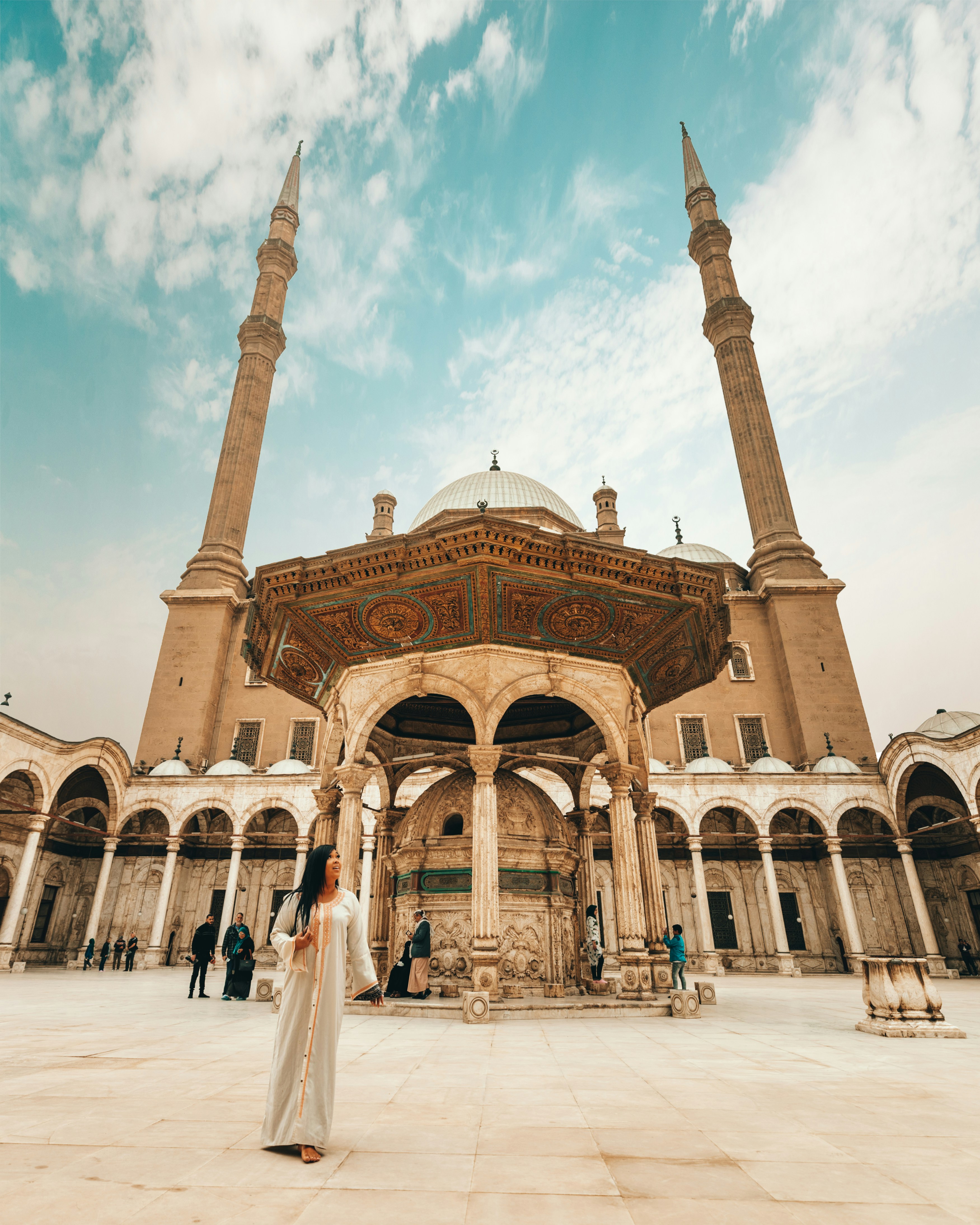 Woman standing near mosque during daytime photo – Free Mosque Image on ...