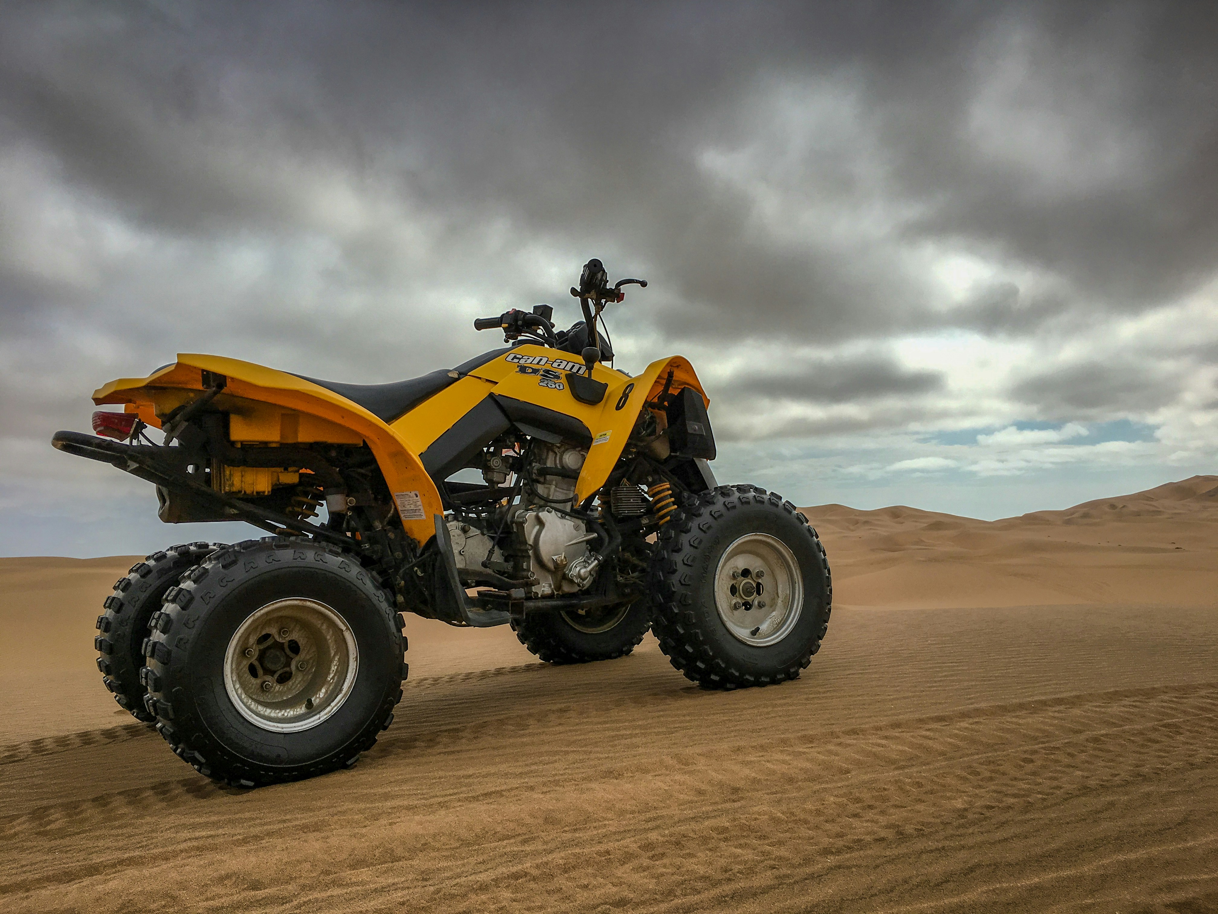 Red and black ATV under nimbus clouds photo – Free Vehicle Image on ...