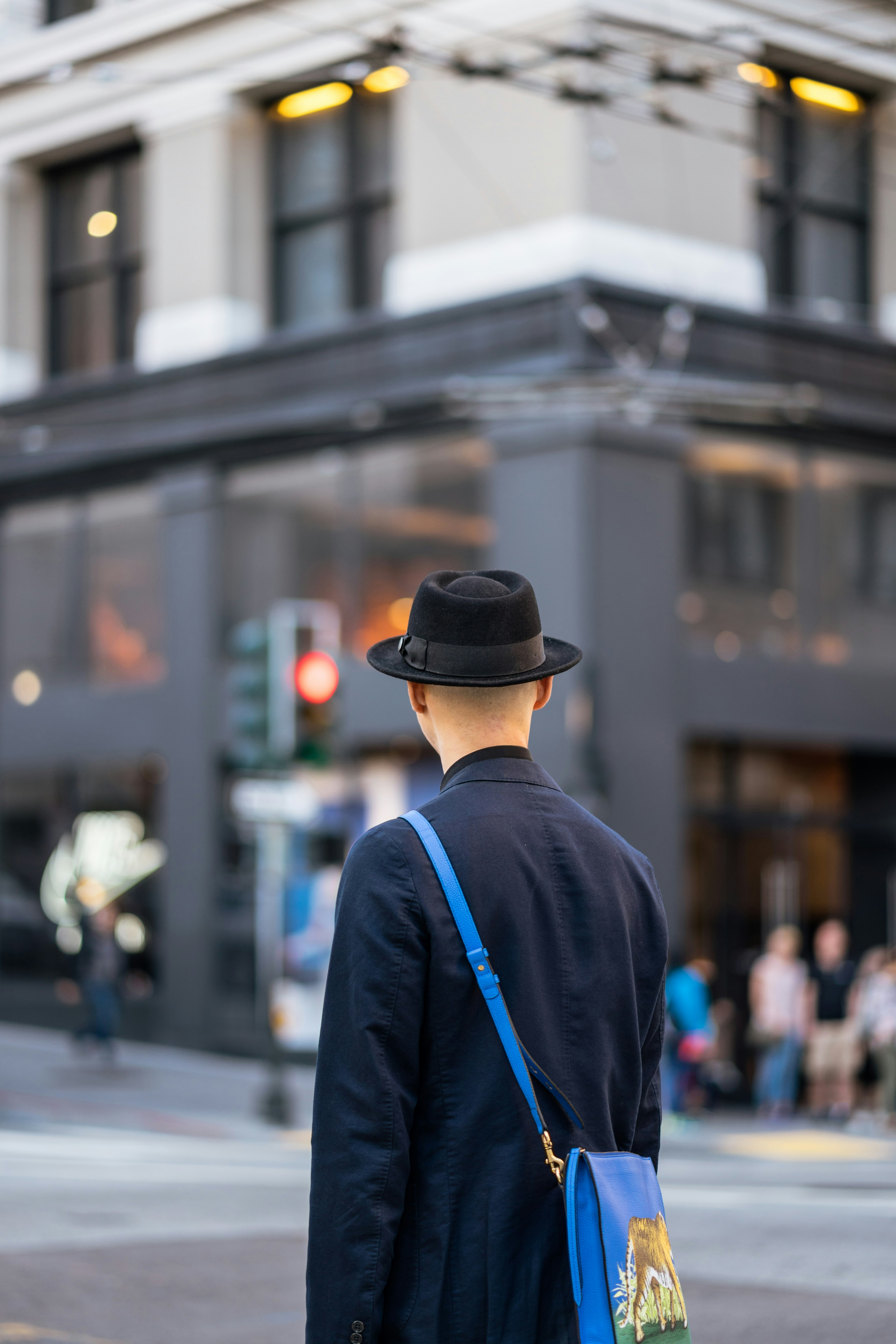 Person wearing fedora hat and blue coat photo – Free Hat Image on Unsplash
