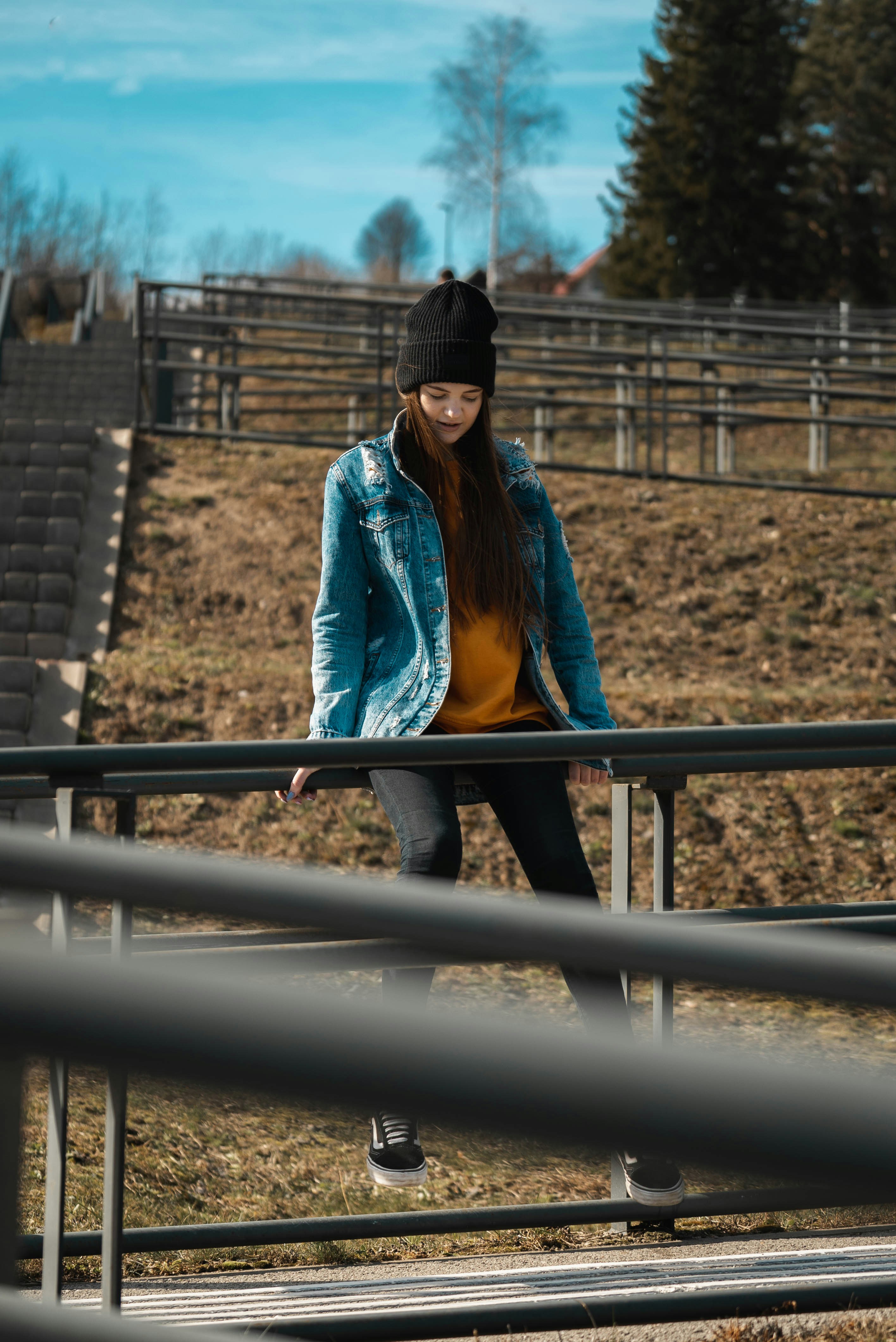 Railside Portrait: Denim, Mustard, and Morning Light