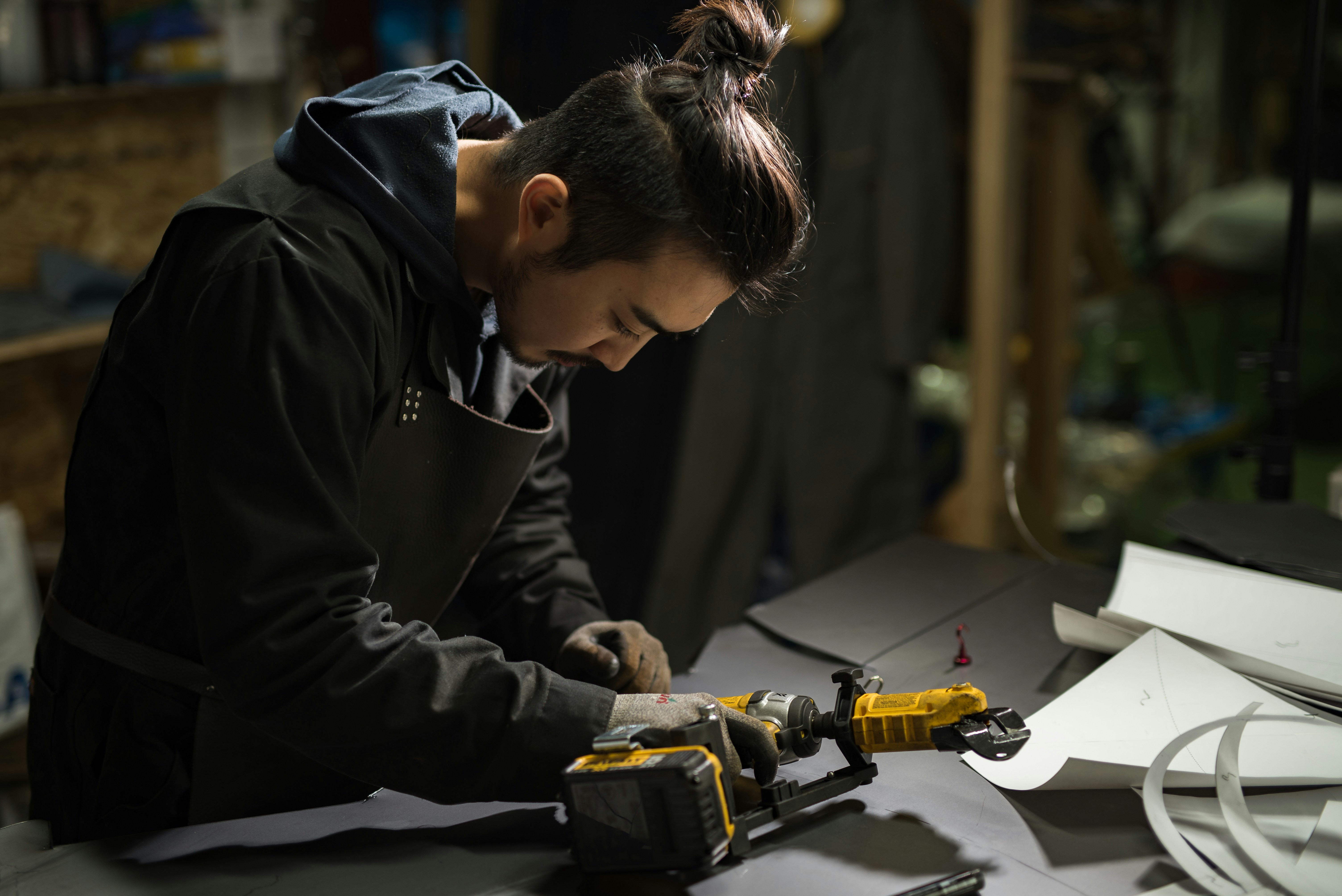 Man holding power tool photo – Free Black Image on Unsplash