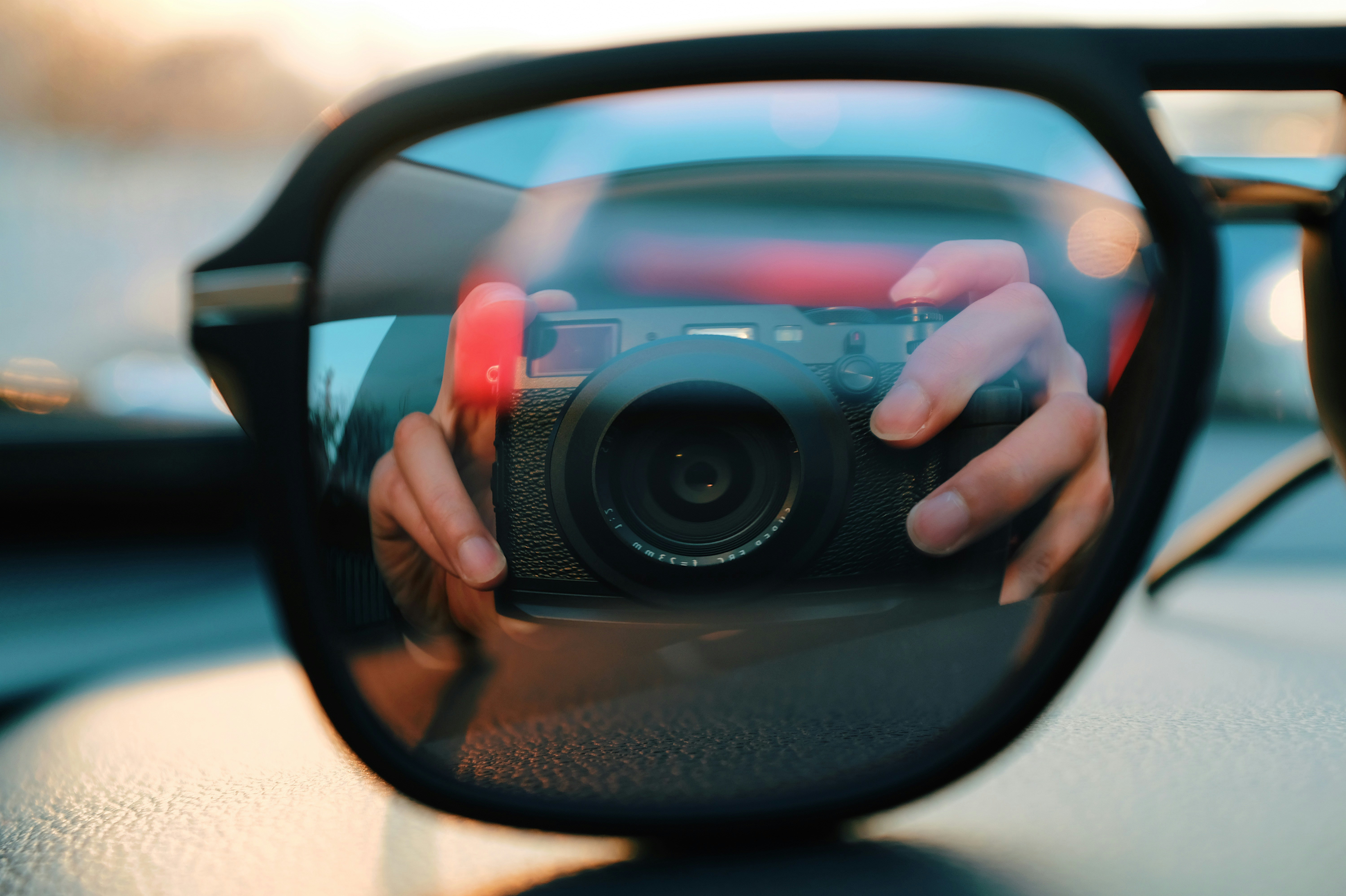 Through the Glass: A Compact Lens Reflects Its Own Gaze