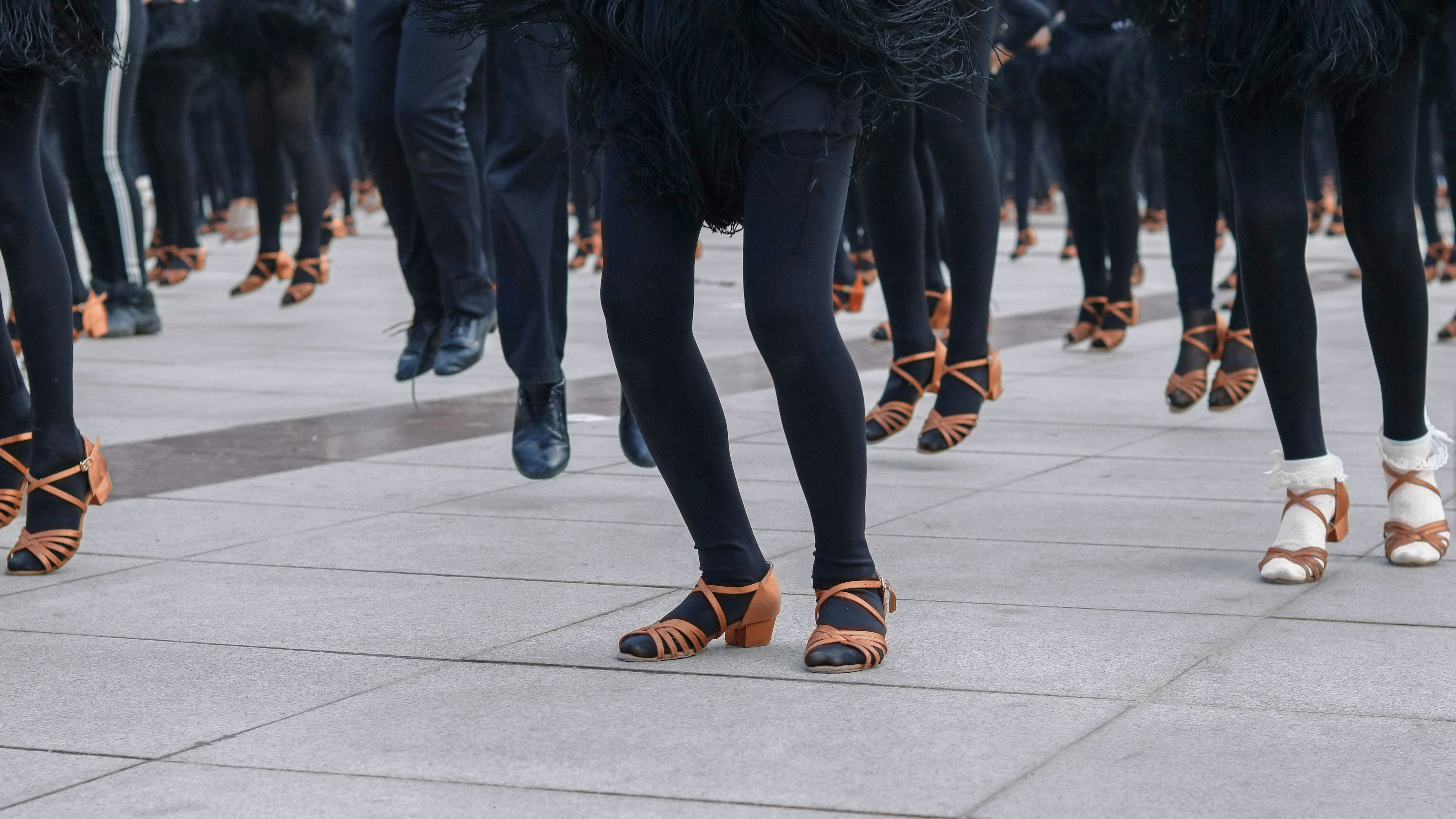 Sea of Sandals: A Low-Angle Dance Across the Plaza