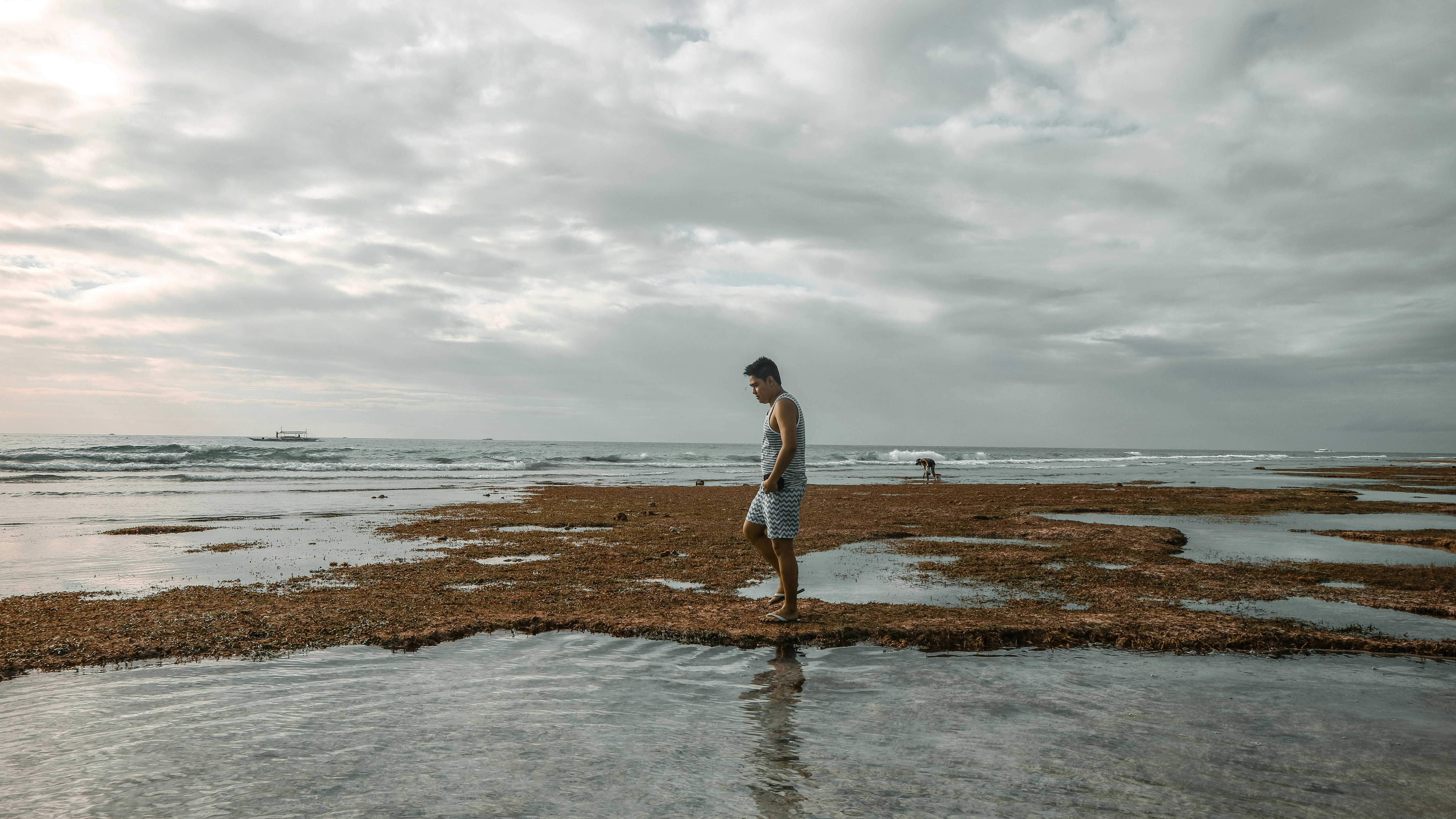 Man standing on body of water photo – Free Human Image on Unsplash
