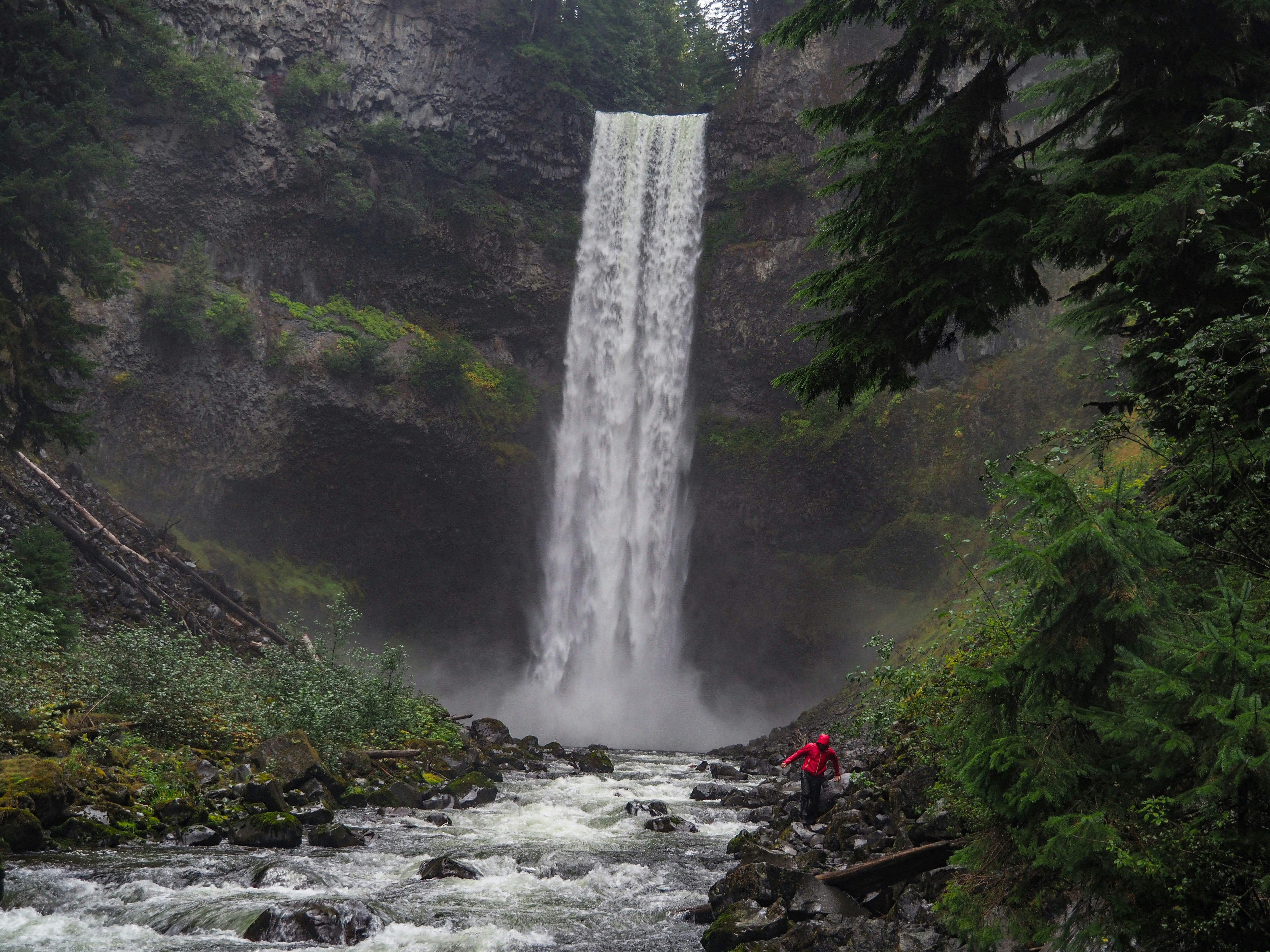 Person wearing red jacket near waterfalls photo – Free Grey Image on ...