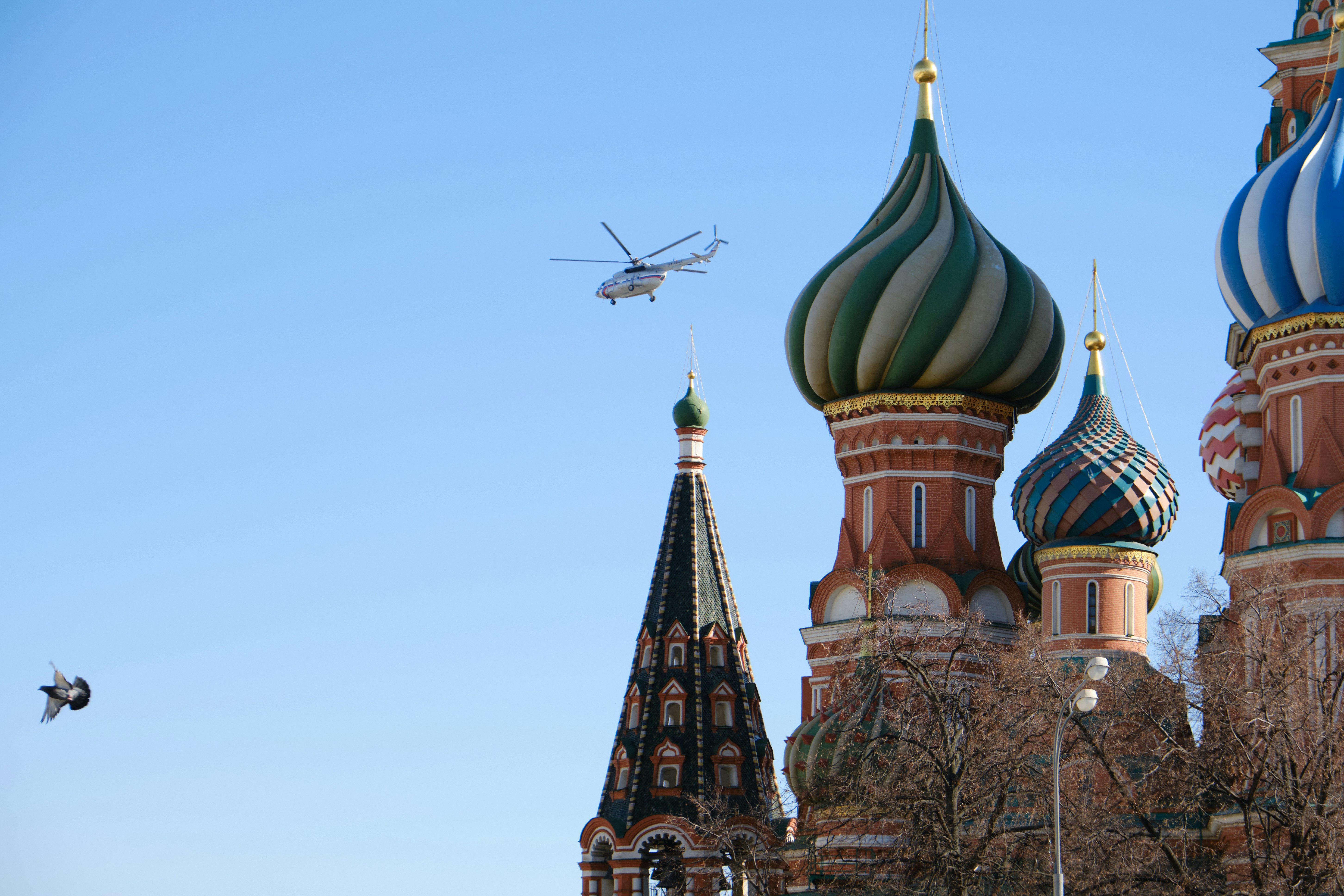 Floating Spotlight over St. Basil's: Aerial View of Kremlin Rooftops