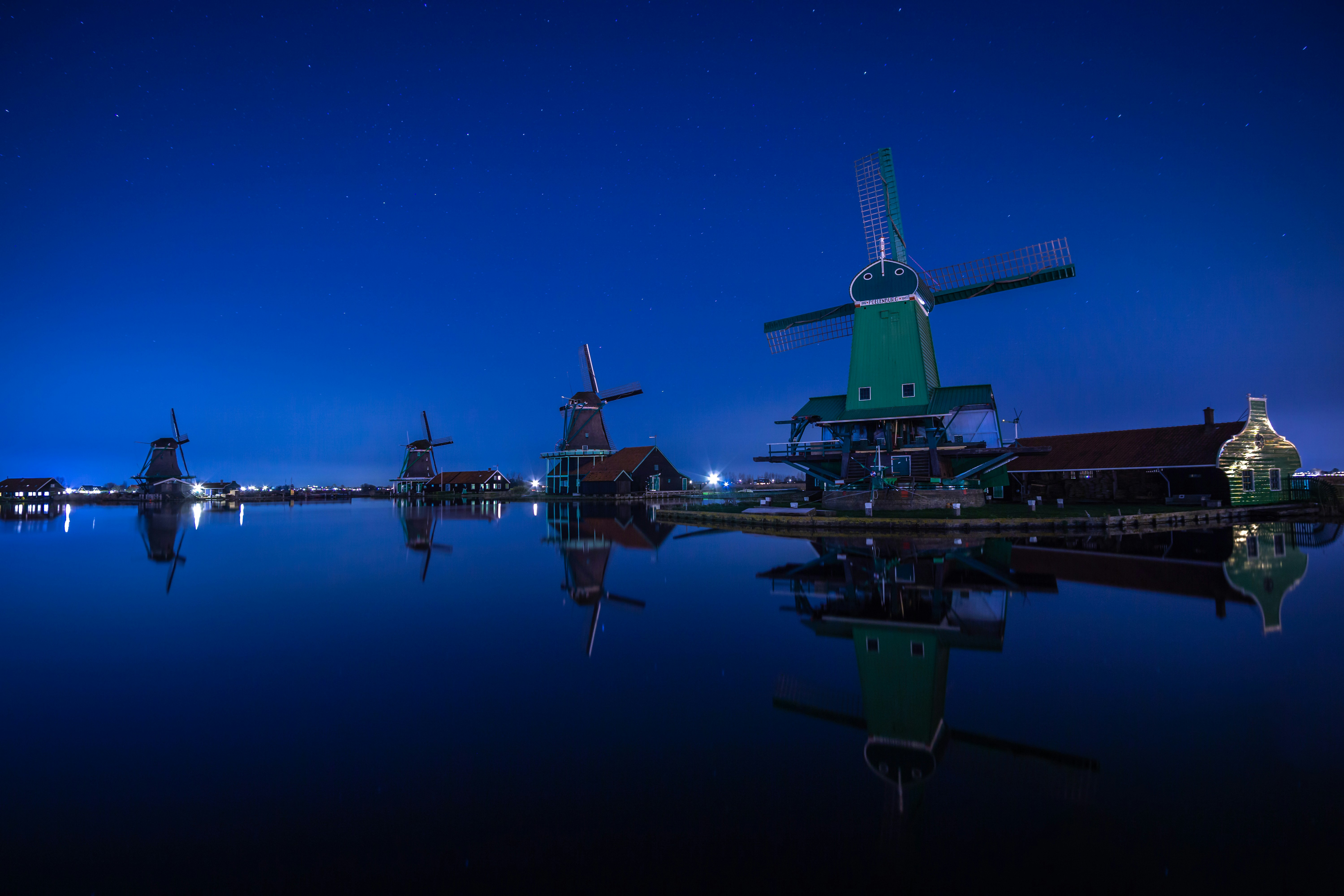 Moonlit Windmills Over a Glassy Canal