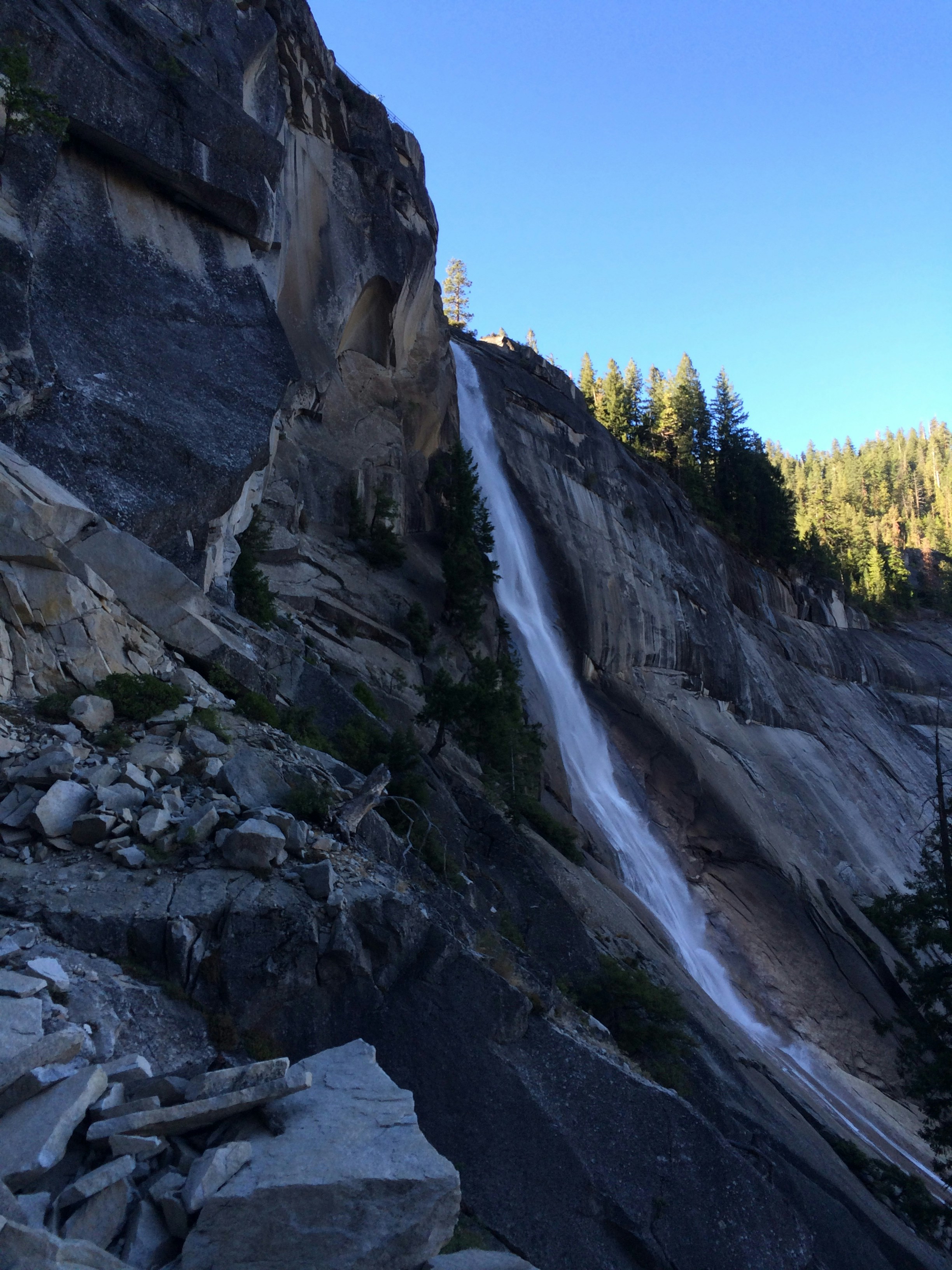 Waterfalls under clear blue sky photo – Free Blue Image on Unsplash