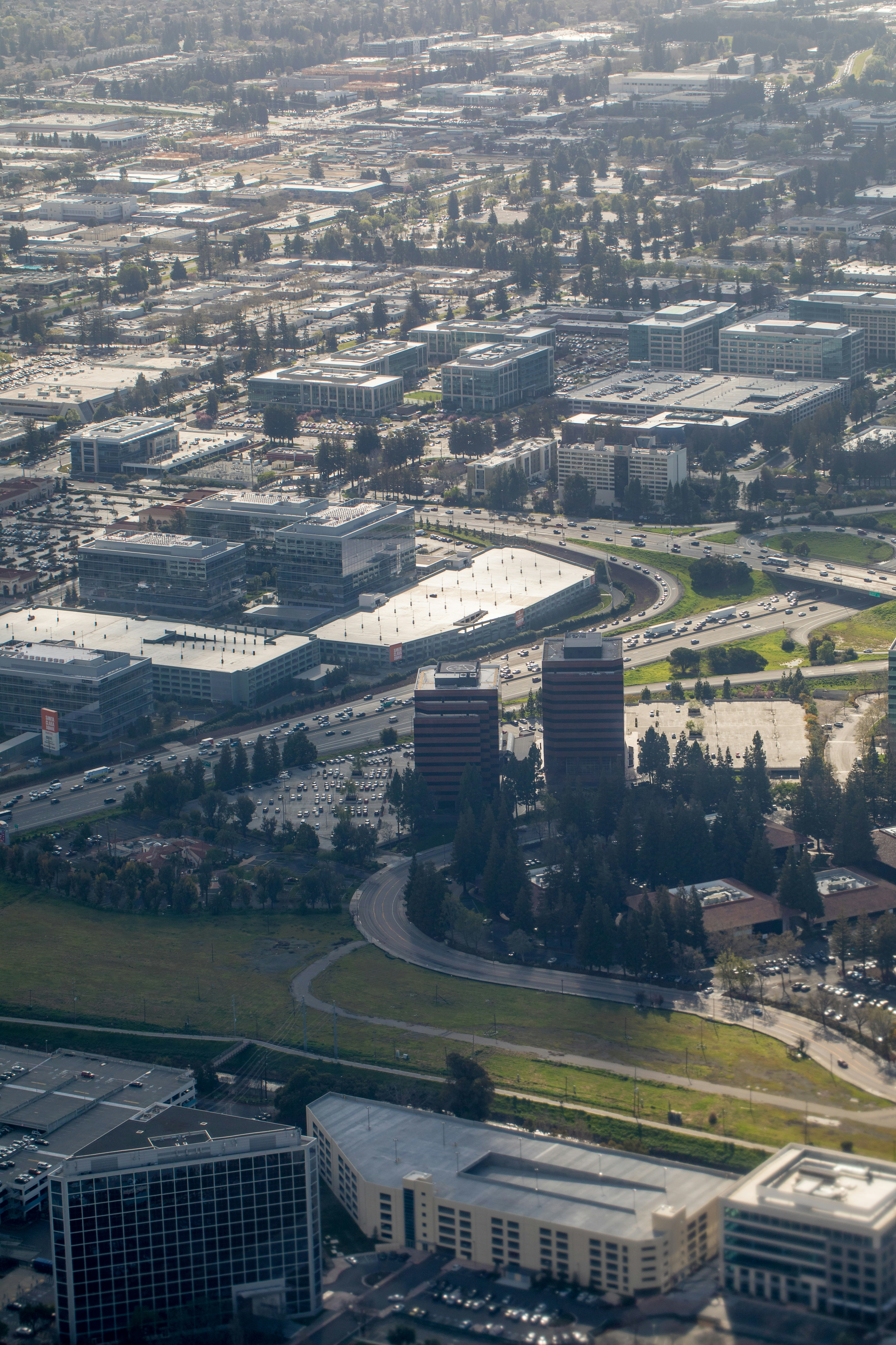 Aerial Mosaic of a Modern Campus Between Roads and Glass