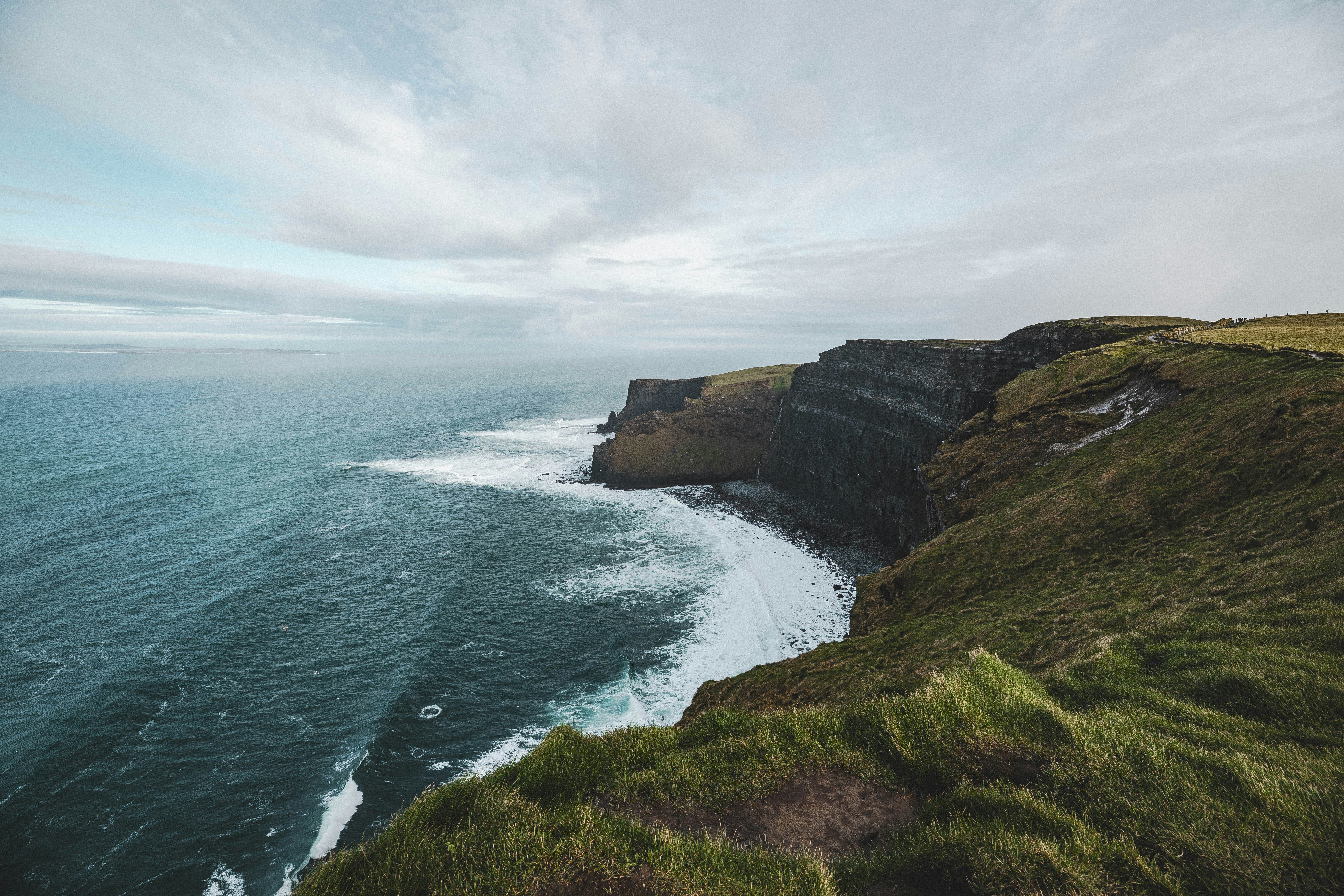 Cliff near body of water photo – Free Ireland Image on Unsplash