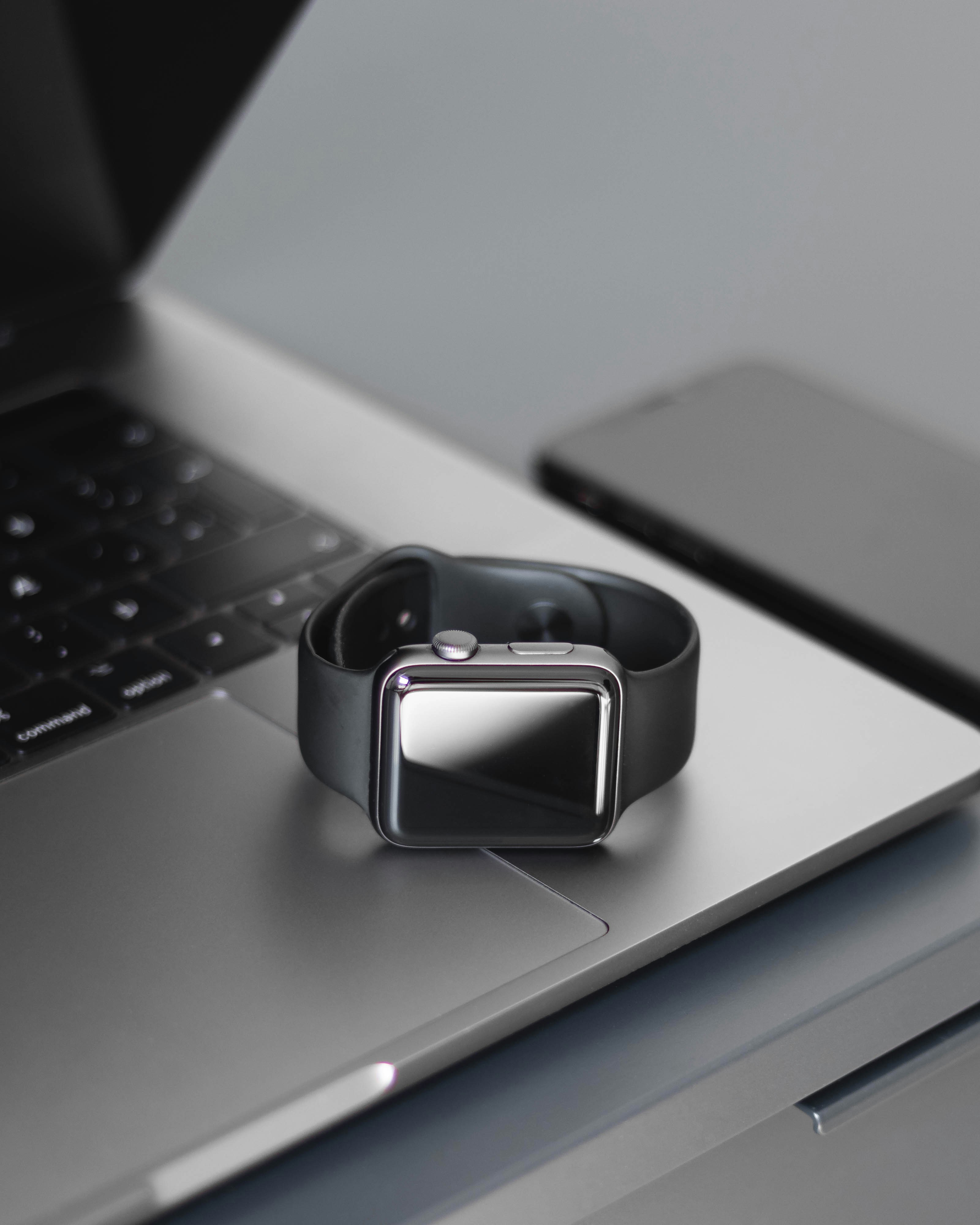 Silver smartwatch on silver laptop photo – Free Grey Image on Unsplash