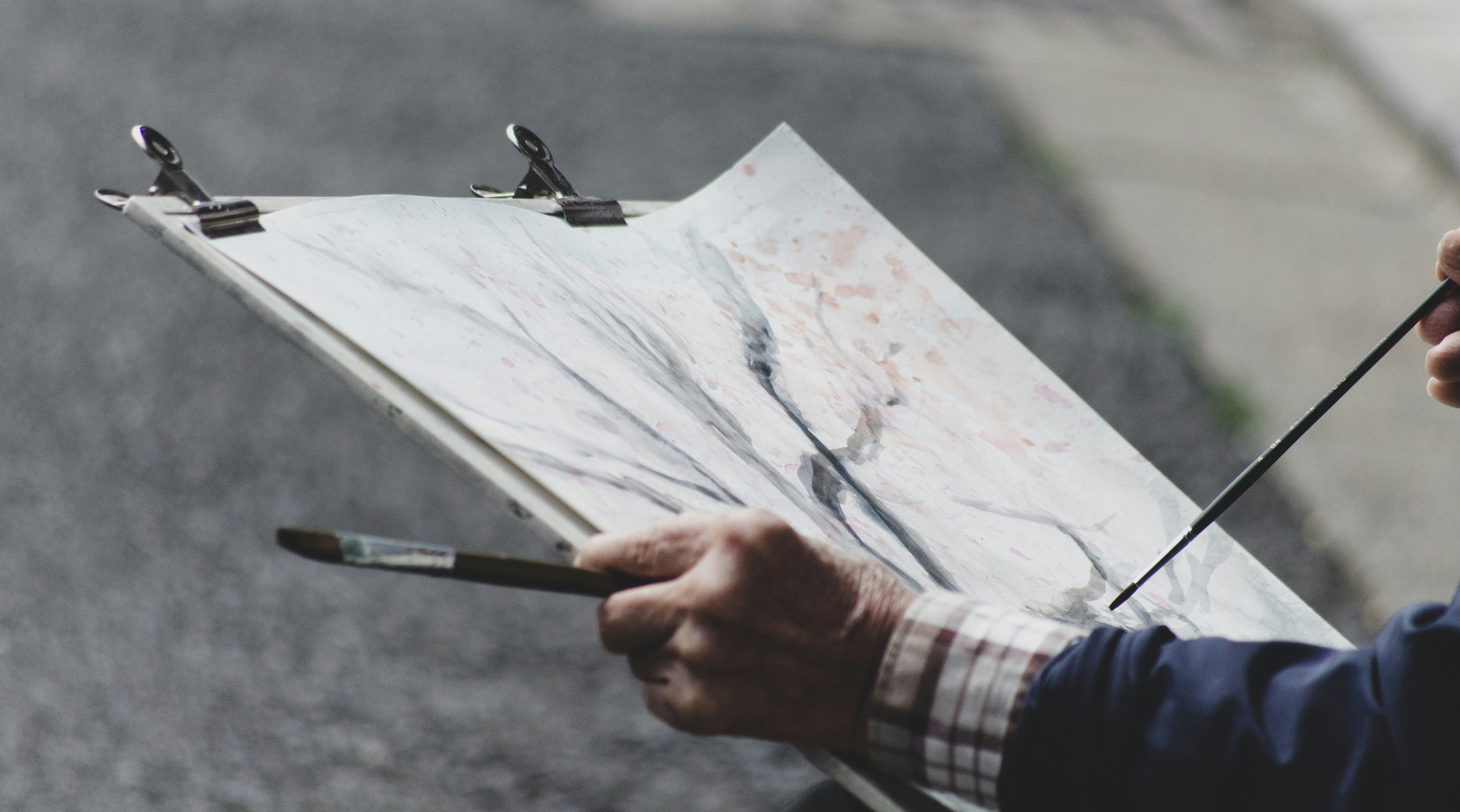 Palette in Hand, Street in Focus: An Artist at Work