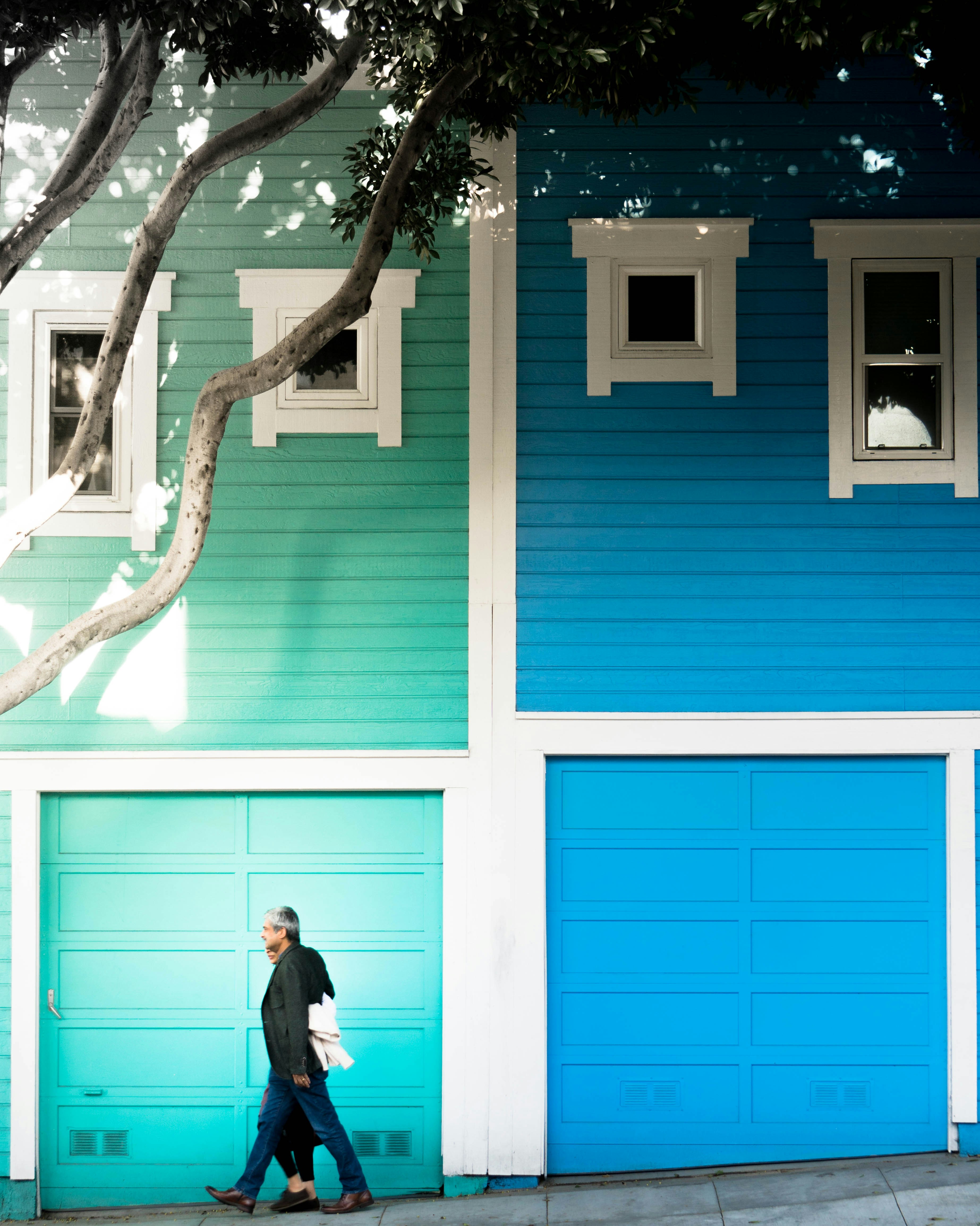 Crossing the Color Divide: A Quiet Walk Before a Two-Tone Garage