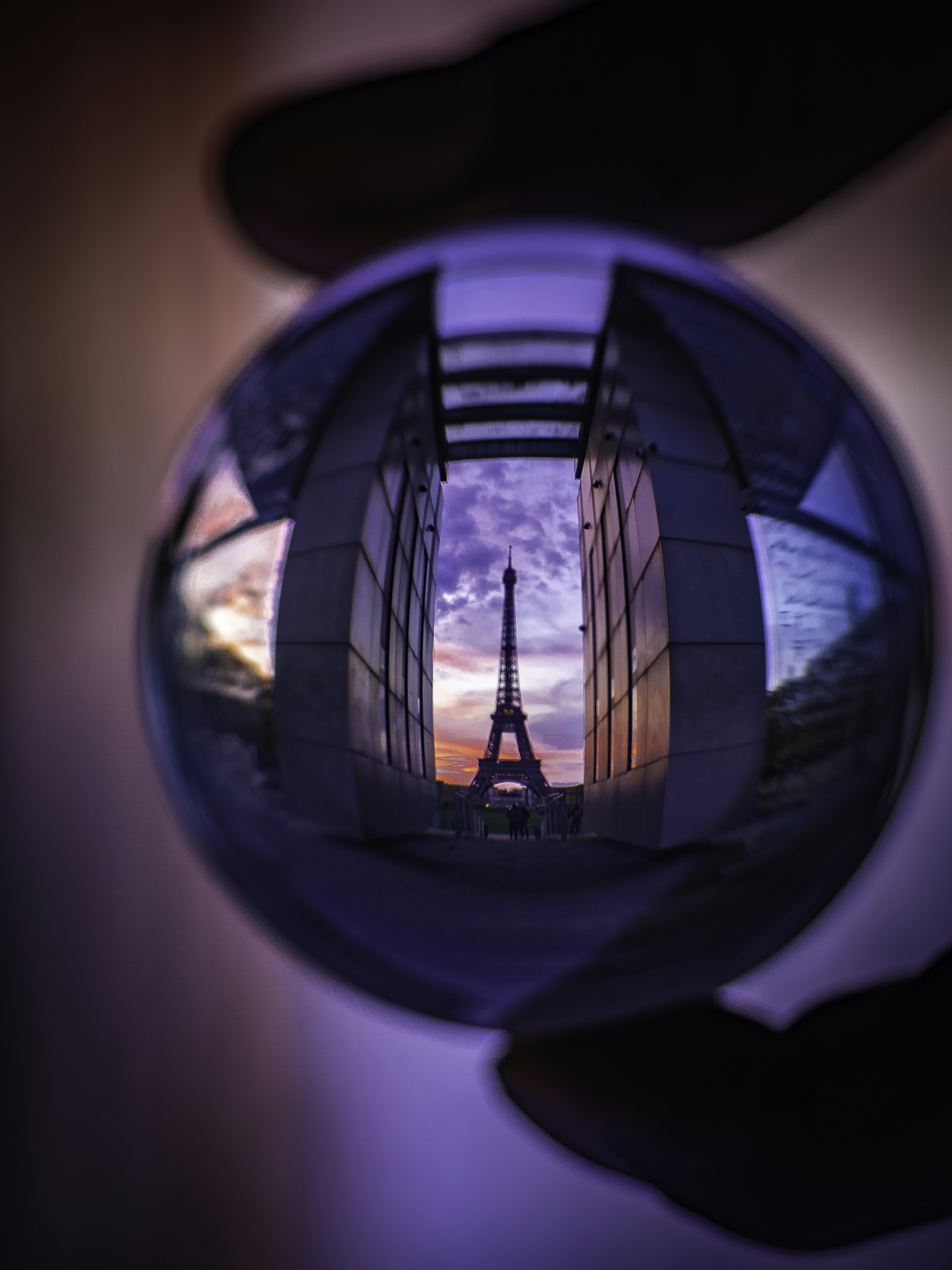 Paris in a Glass Sphere: Eiffel Tower Framed by a Reflected Portal