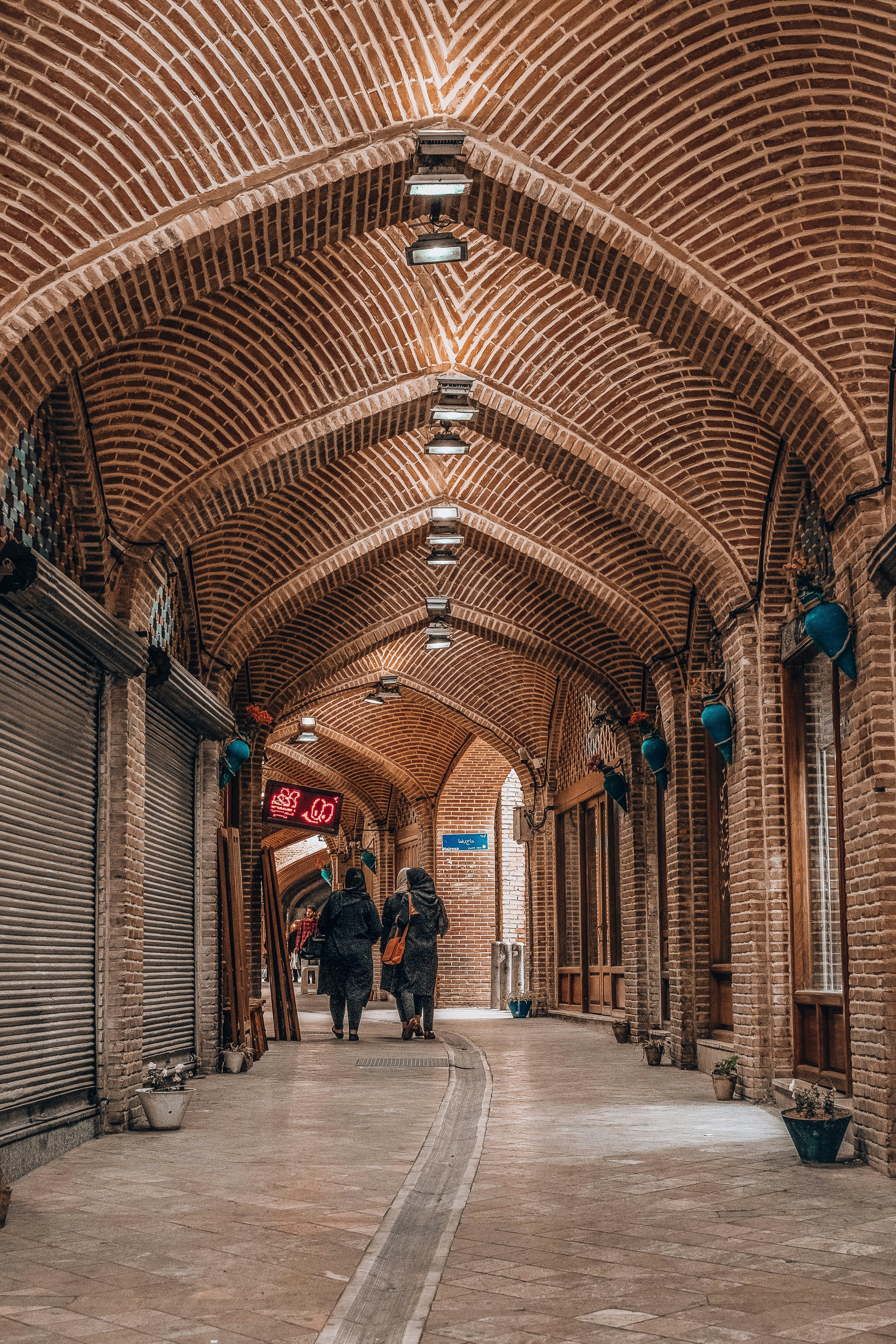 Brick Vaults and Quiet Footsteps: An Archway Market in Warm Light