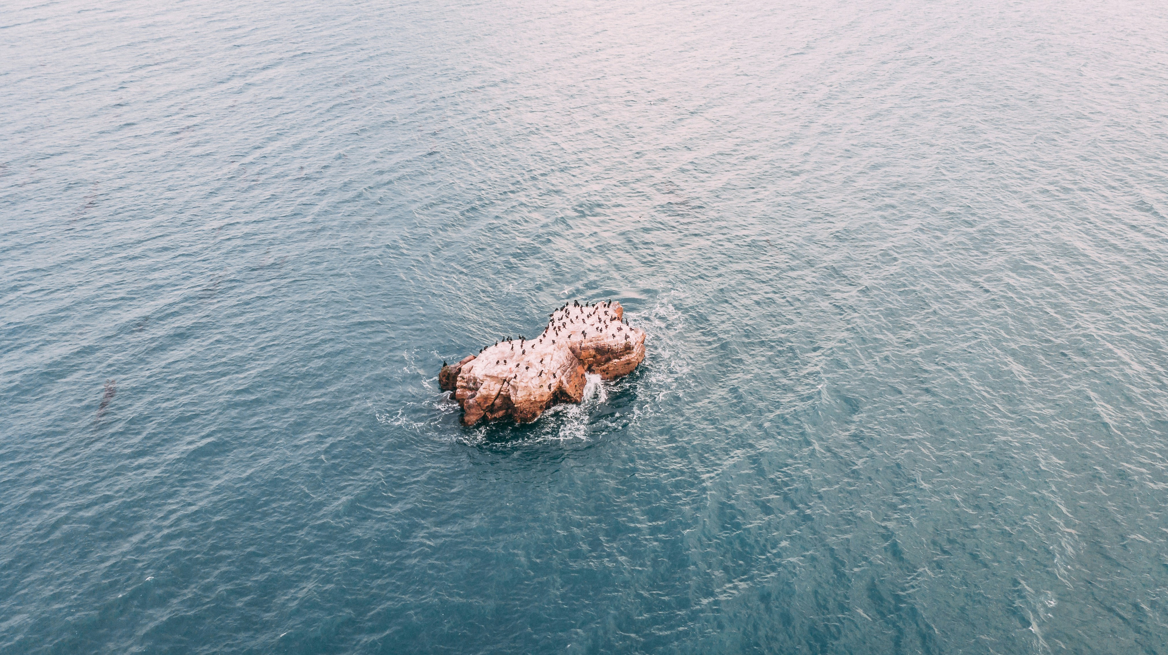 Pink Islet in a Quiet Azure Sea