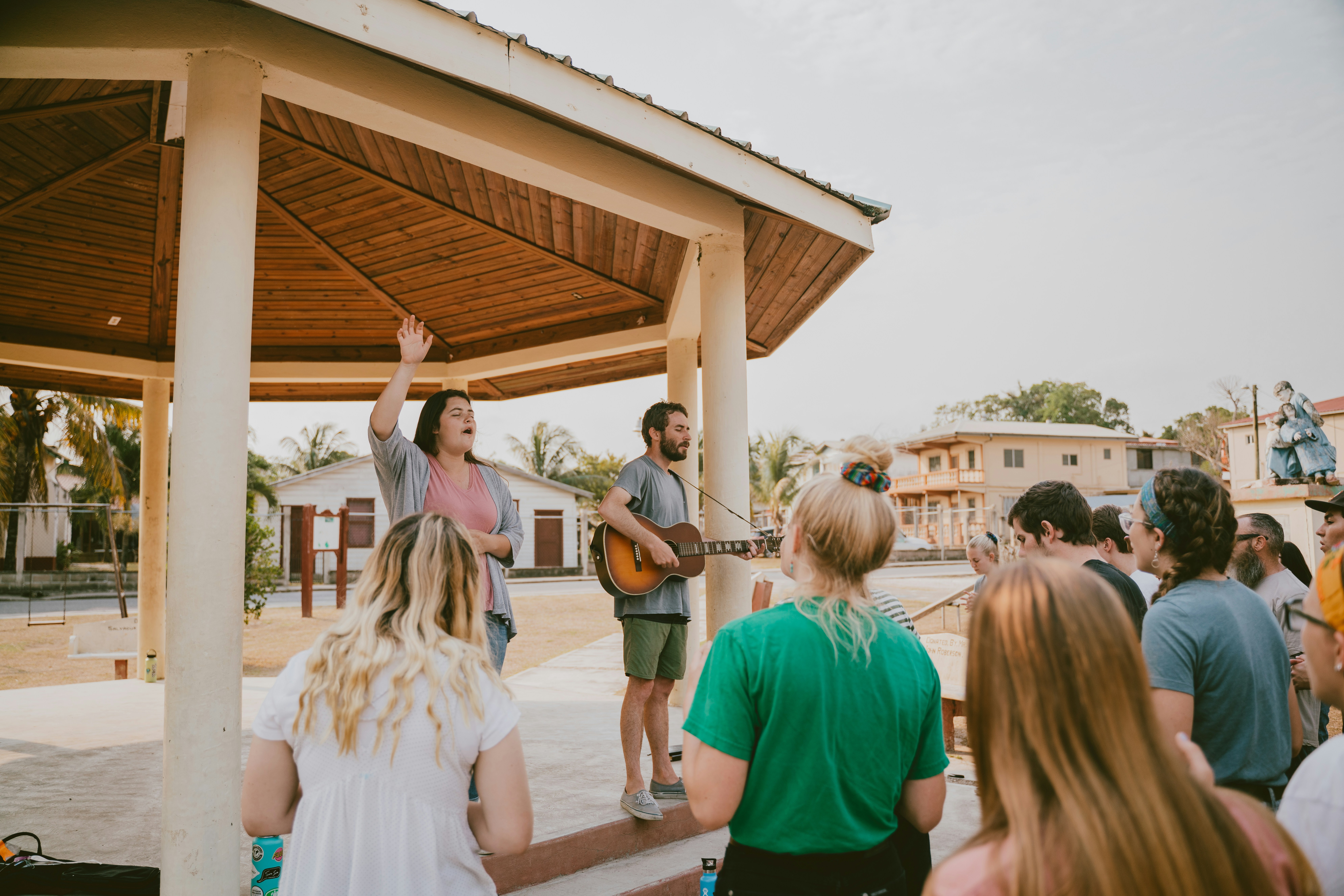 Guitarist Leads a Beachside Shelter Performance