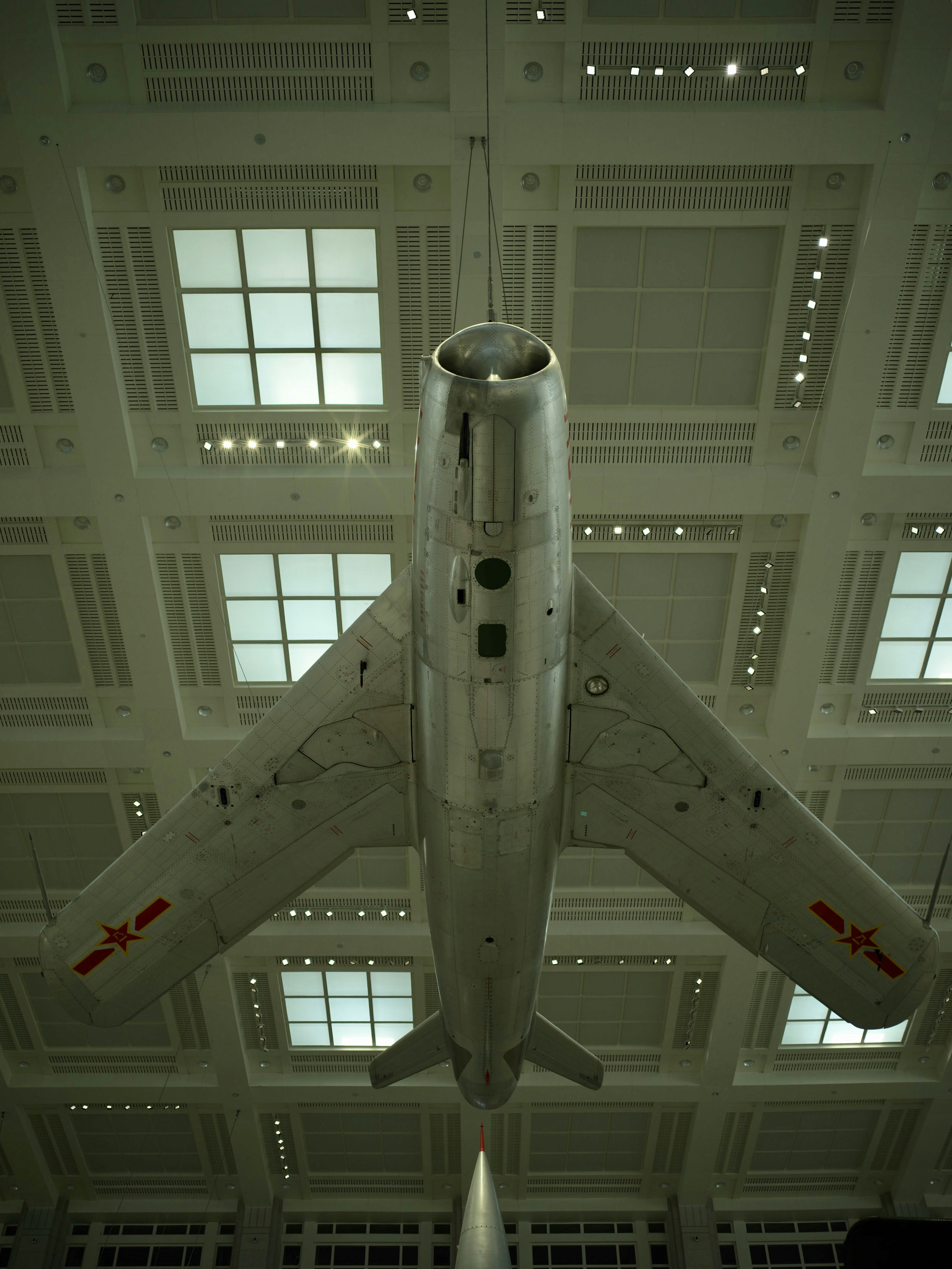 Underbelly of a Cold War Jet: A Centred View in an Exhibition Hall