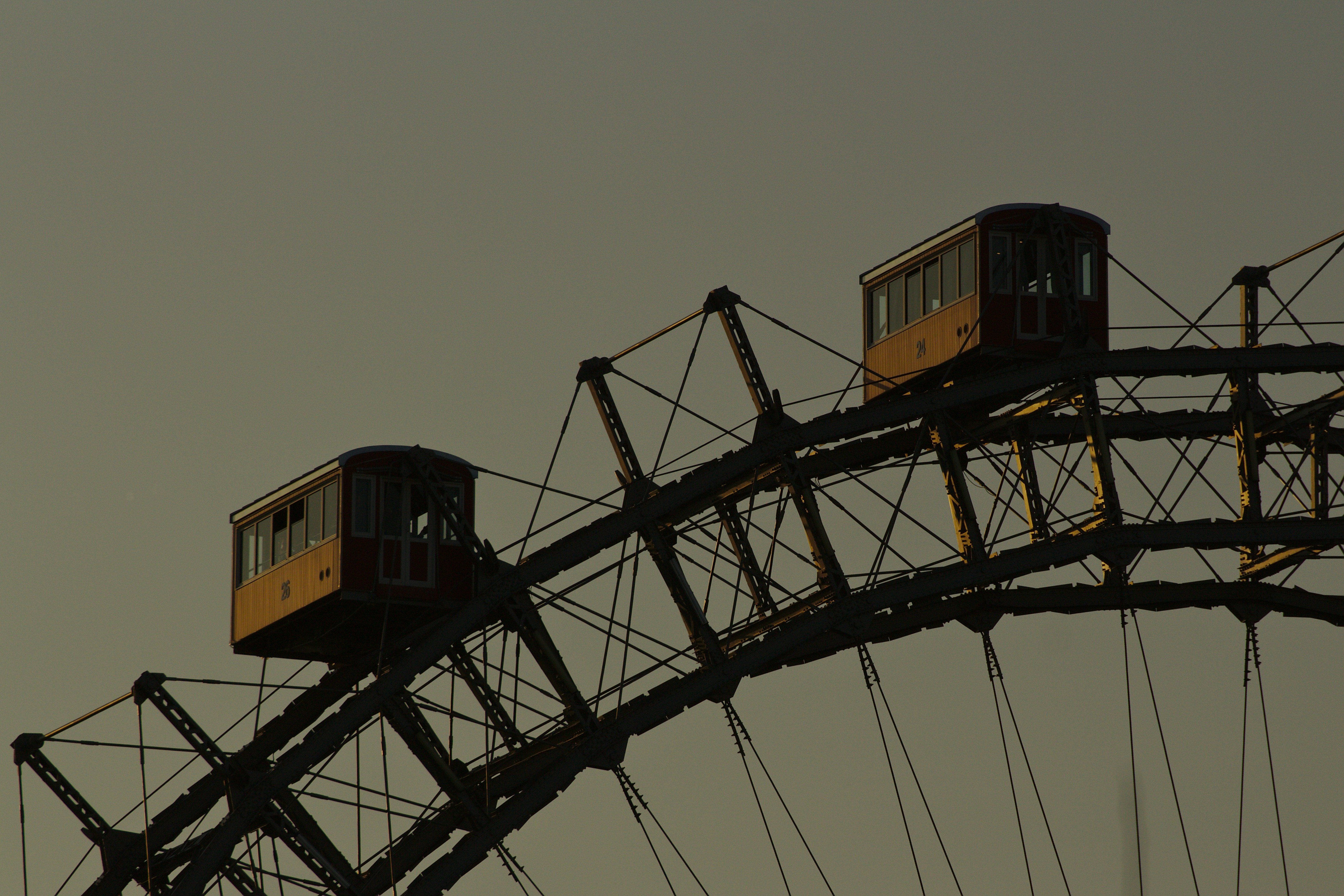 Twilight Arc: Yellow Gondolas on a Steel Curve